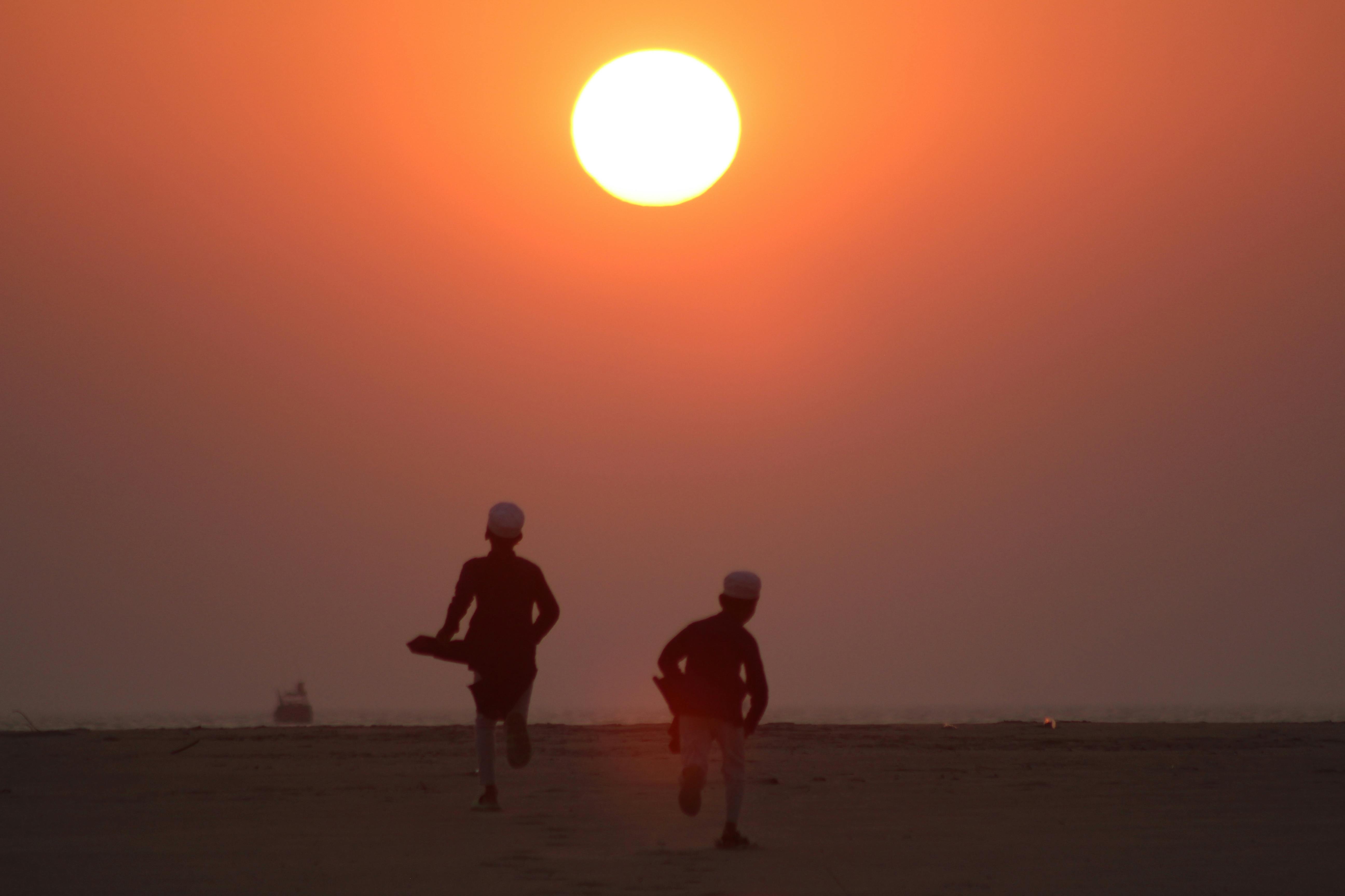 Children Running on Beach at Sunset · Free Stock Photo