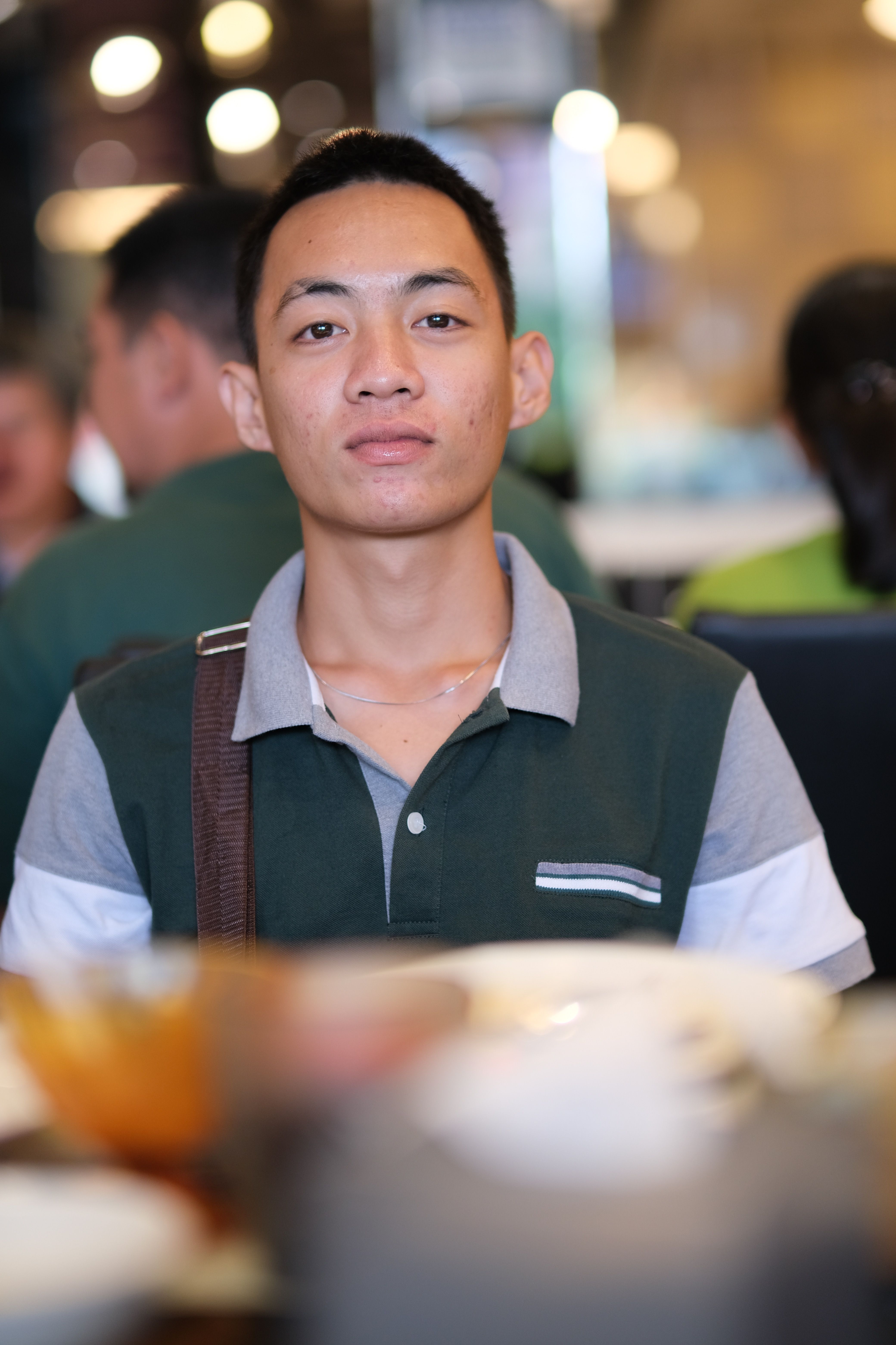 A man sitting at a table in a restaurant · Free Stock Photo