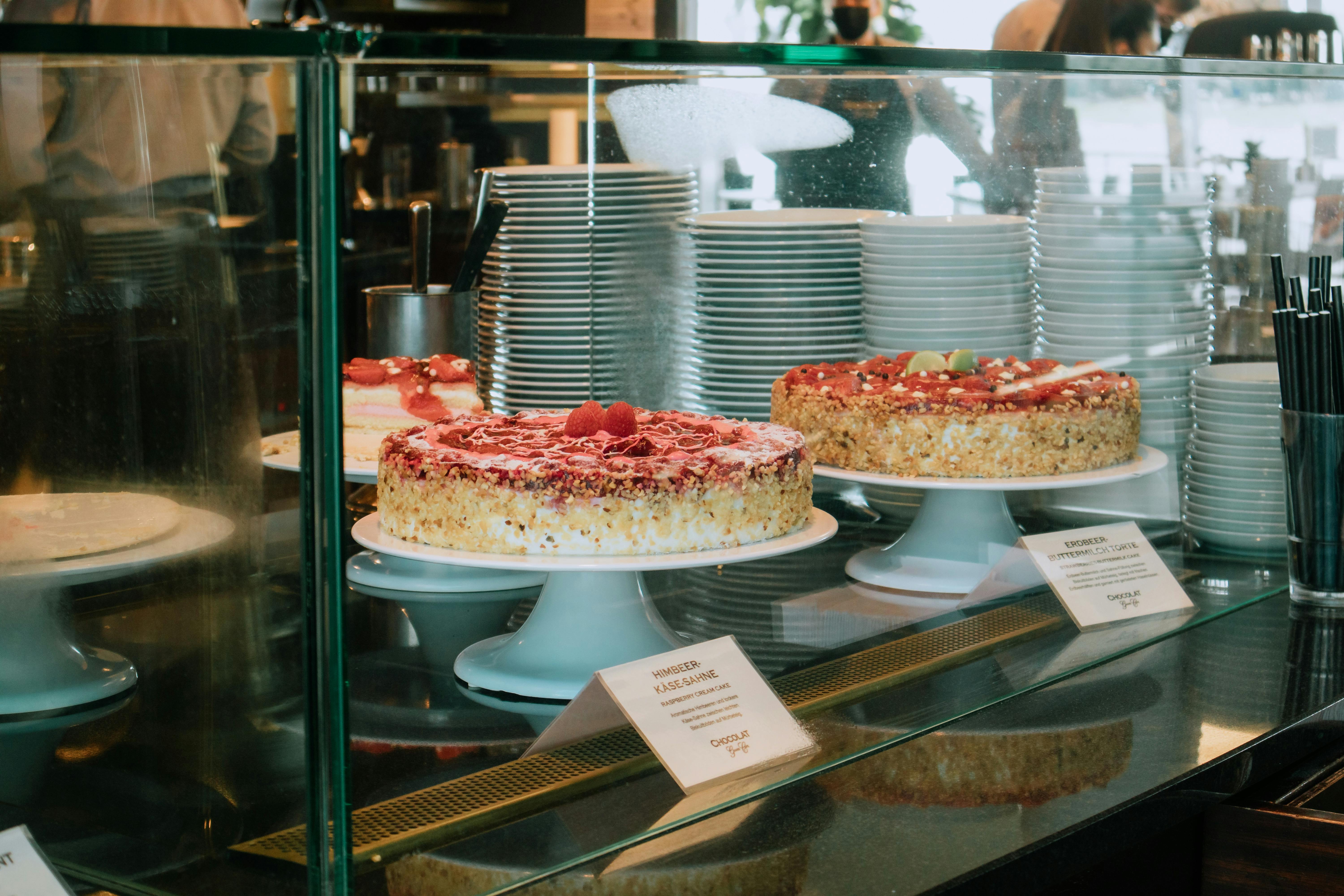 A display case with cakes and other desserts · Free Stock Photo
