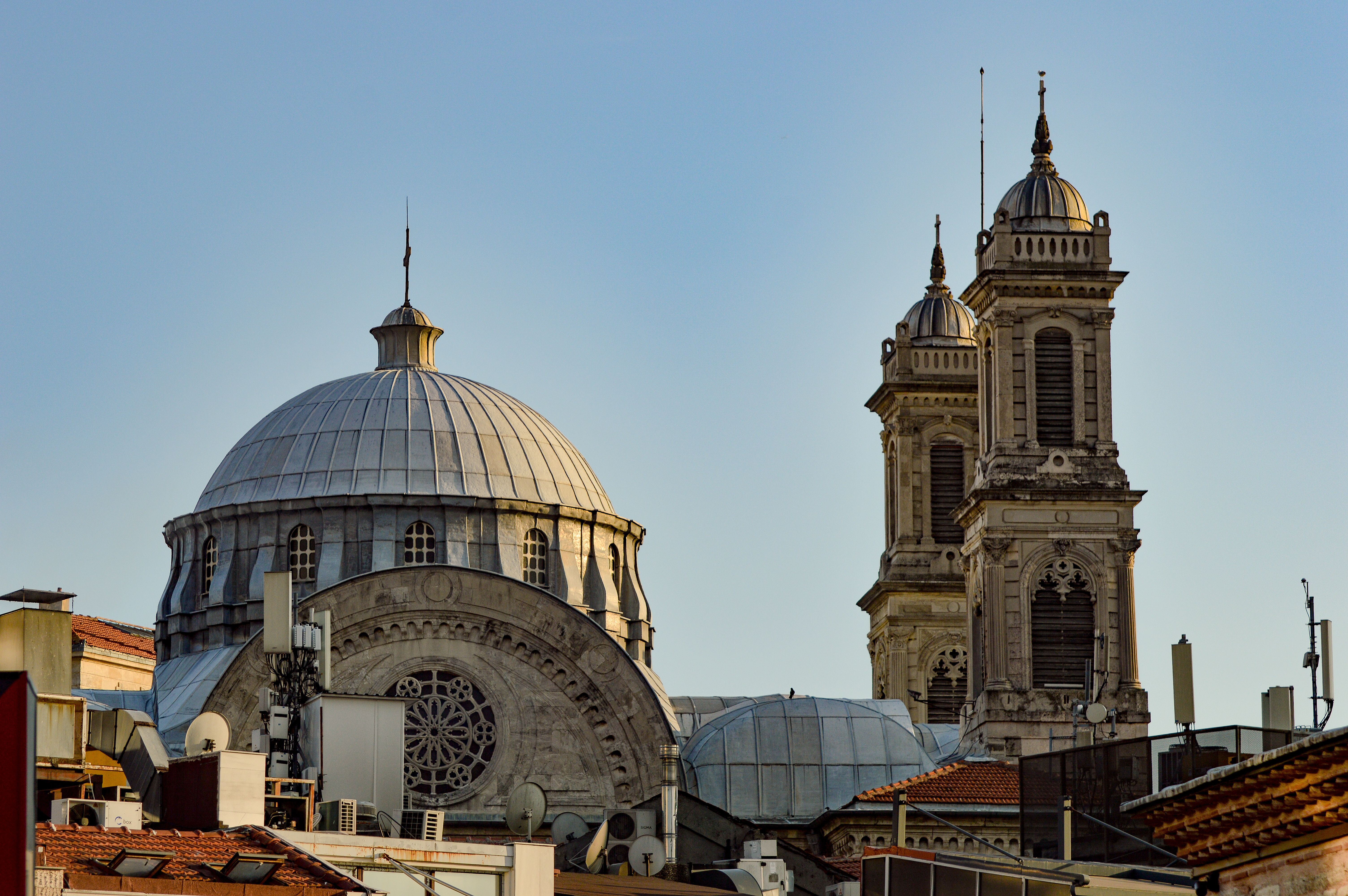 Two domes on top of a building with a clock · Free Stock Photo