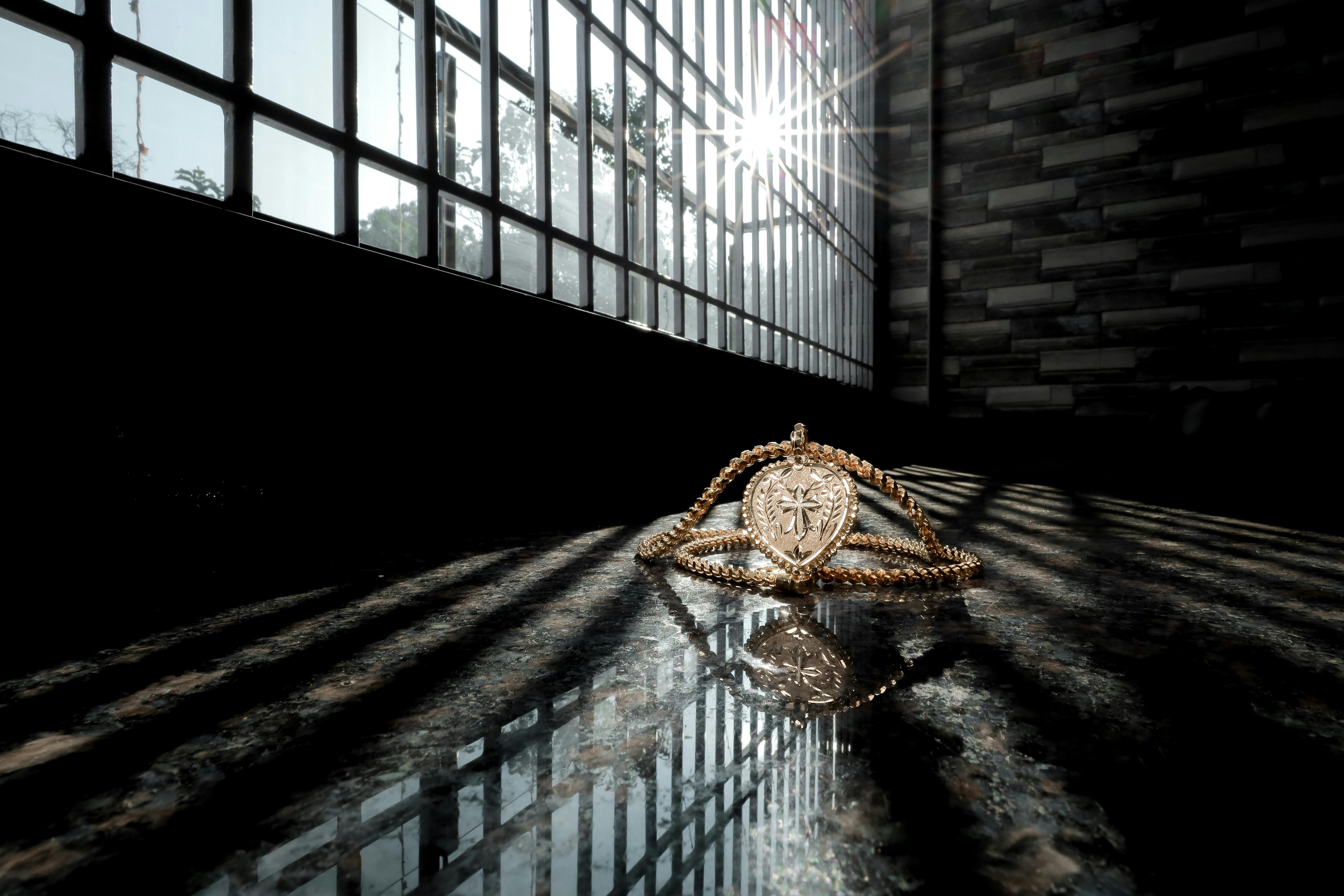 Elegant Gold Bracelet on Granite Surface · Free Stock Photo