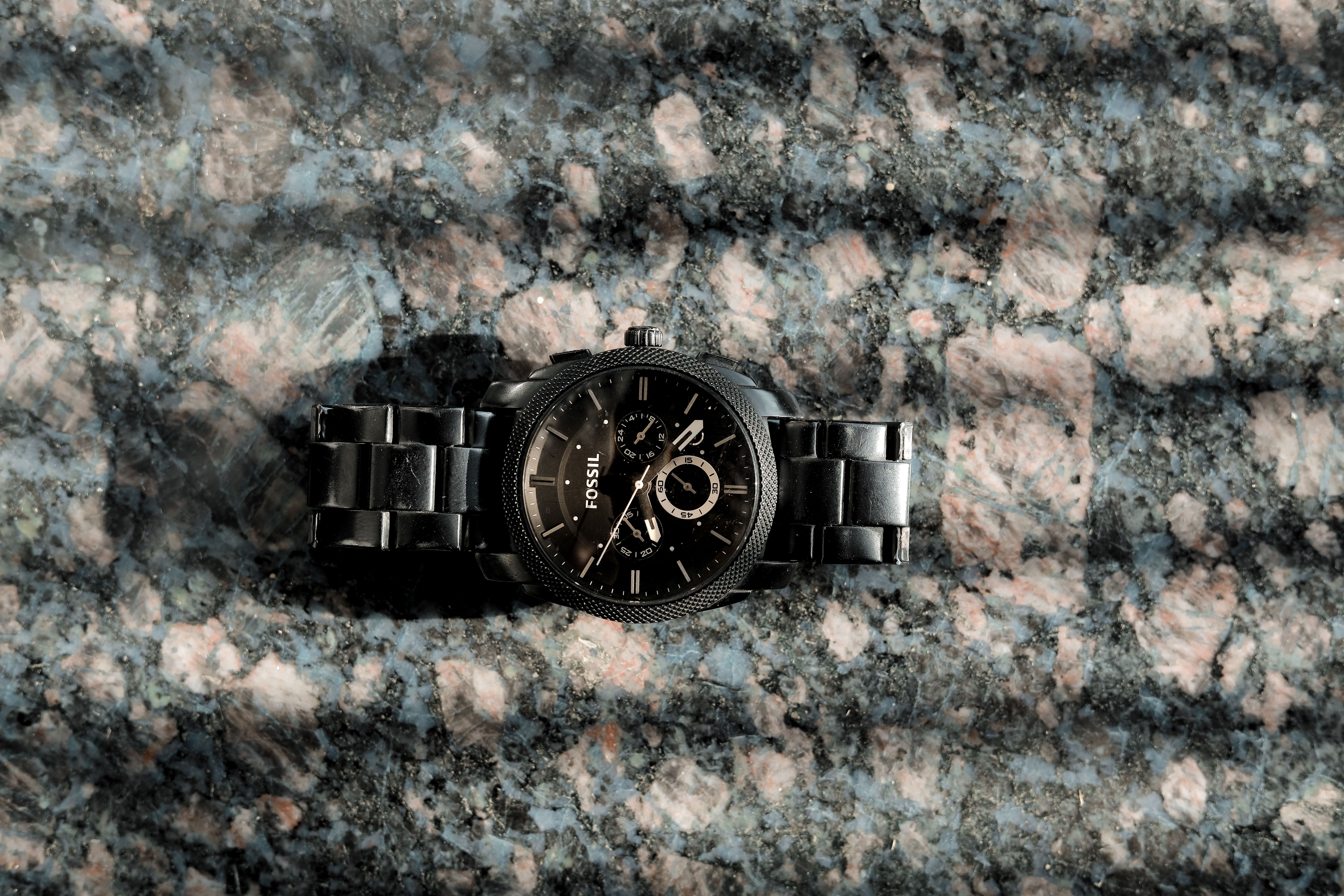 Stylish Fossil Watch on Granite Background · Free Stock Photo