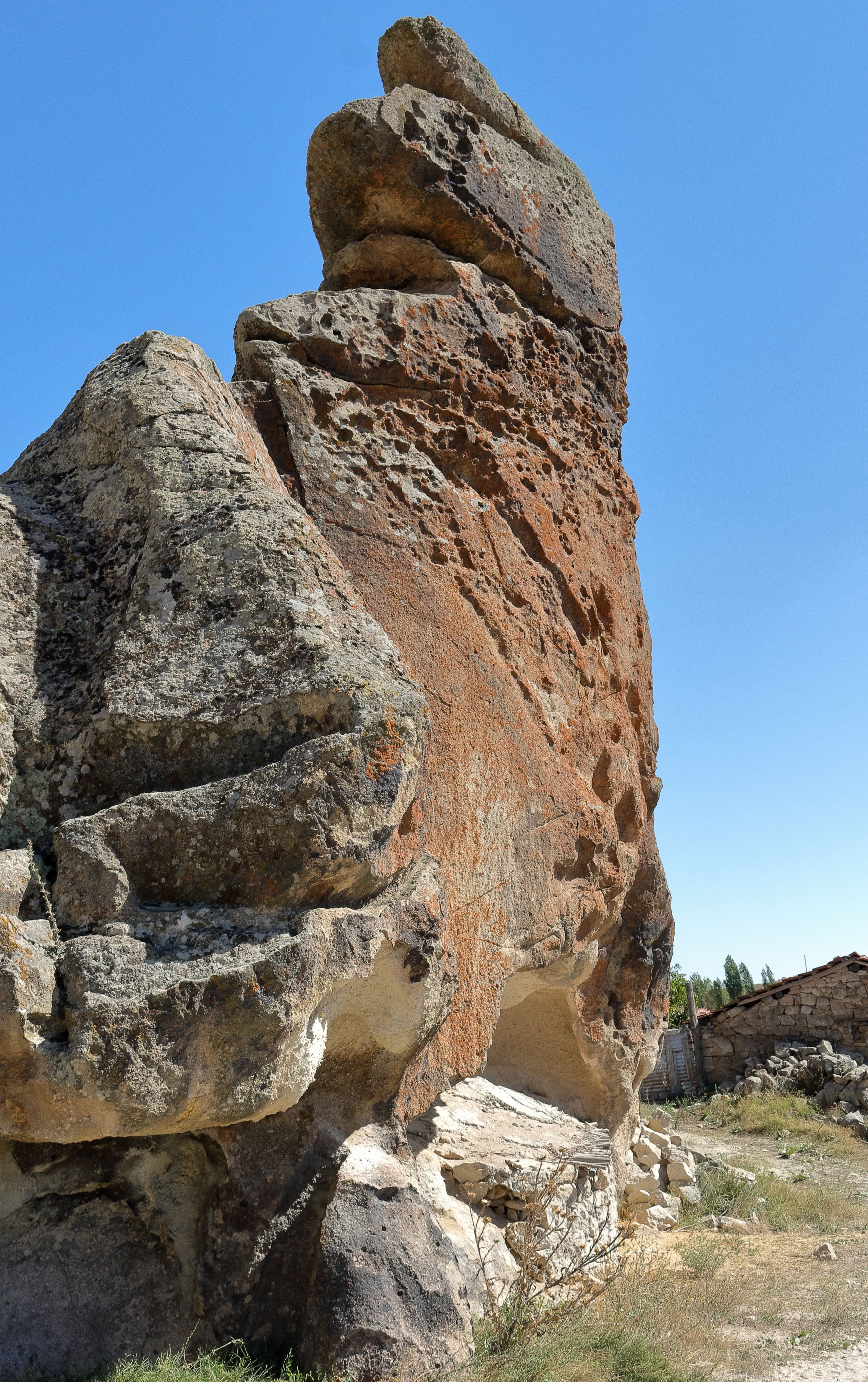 The rock formation is very large and has a large rock on it · Free ...