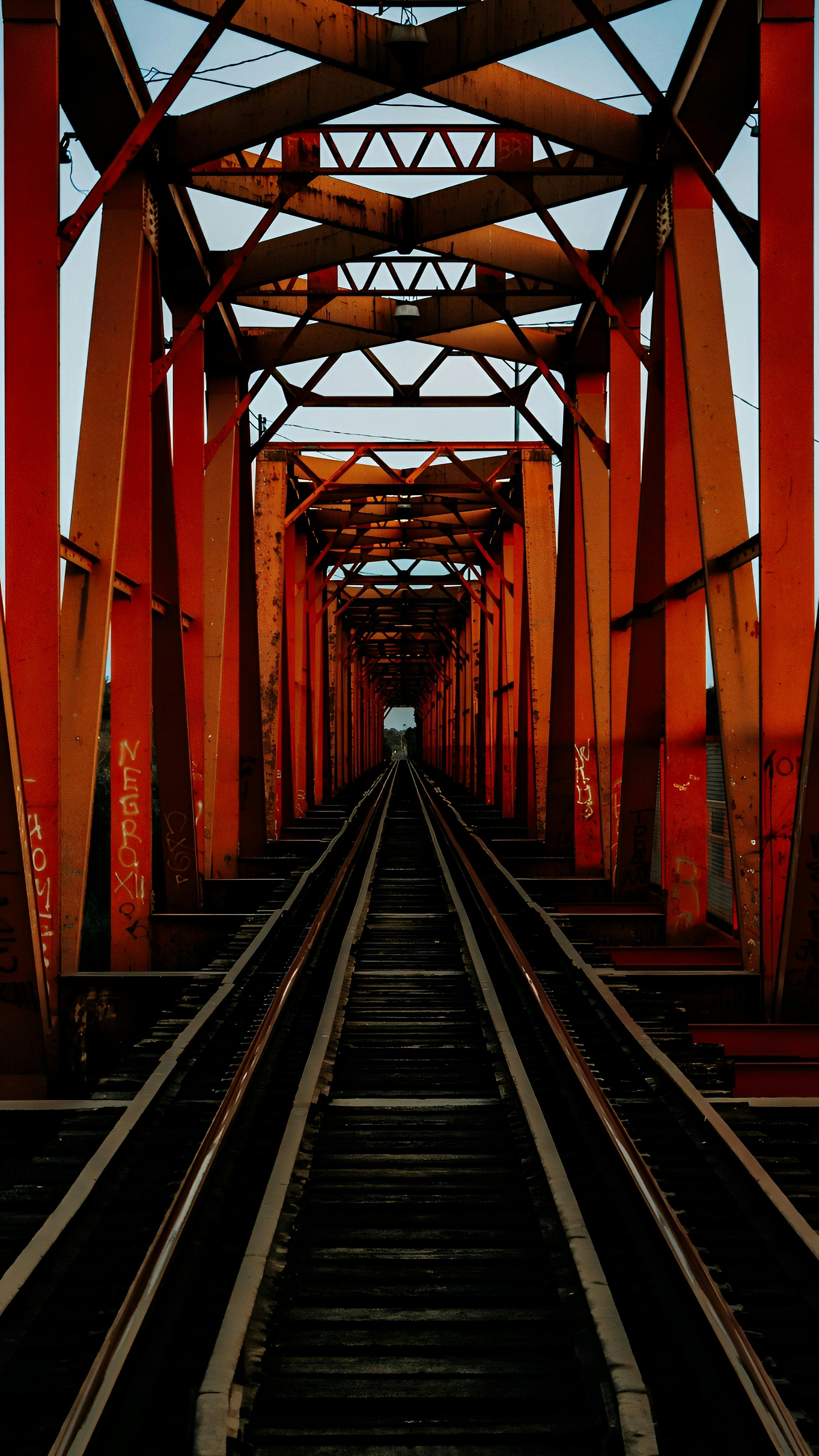A train track with a red and orange sky · Free Stock Photo