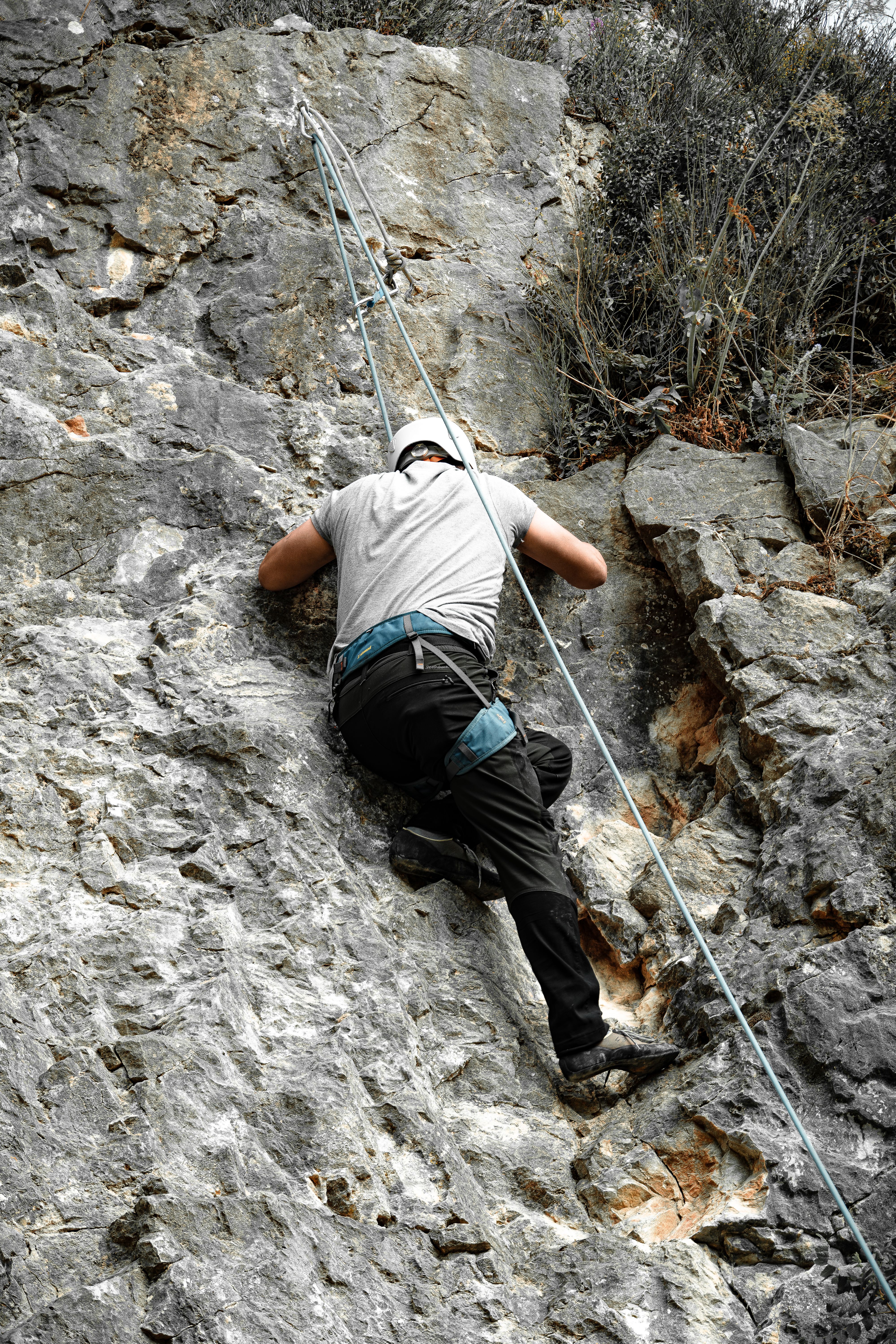 Man Climbing on Gray Concrete Peak at Daytime · Free Stock Photo