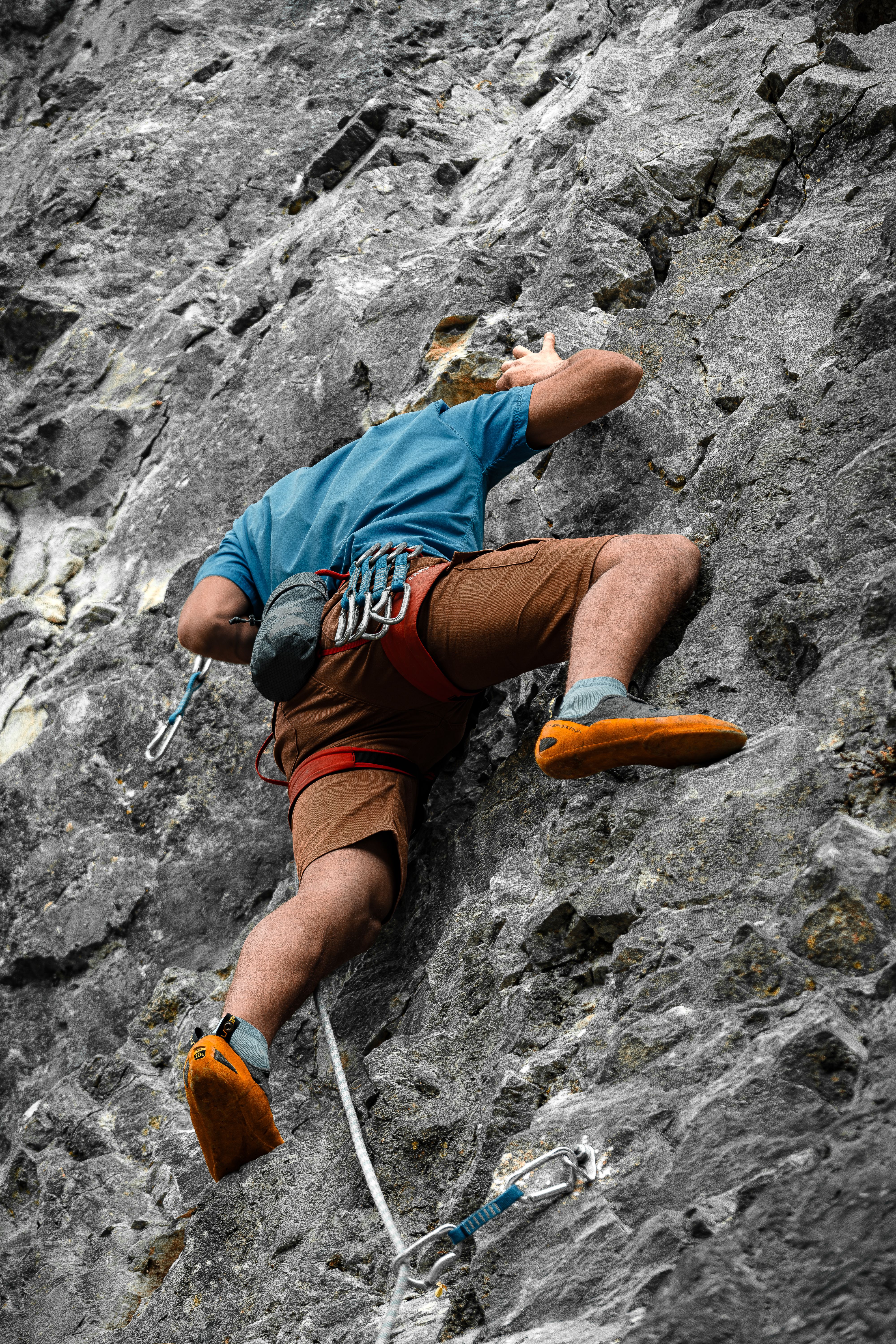 Low Angle Shot of a Man Climbing a Rock · Free Stock Photo
