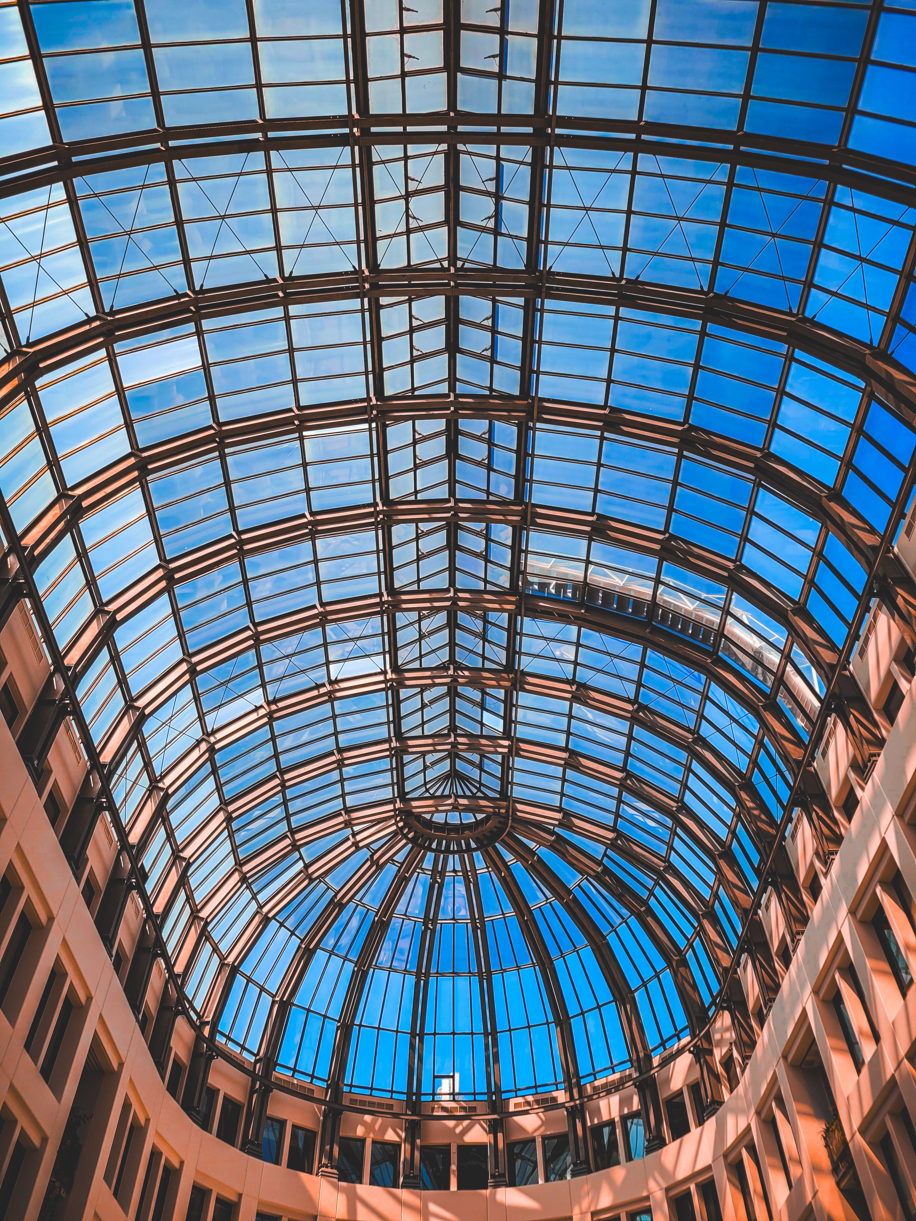 The glass roof of a building with blue sky · Free Stock Photo