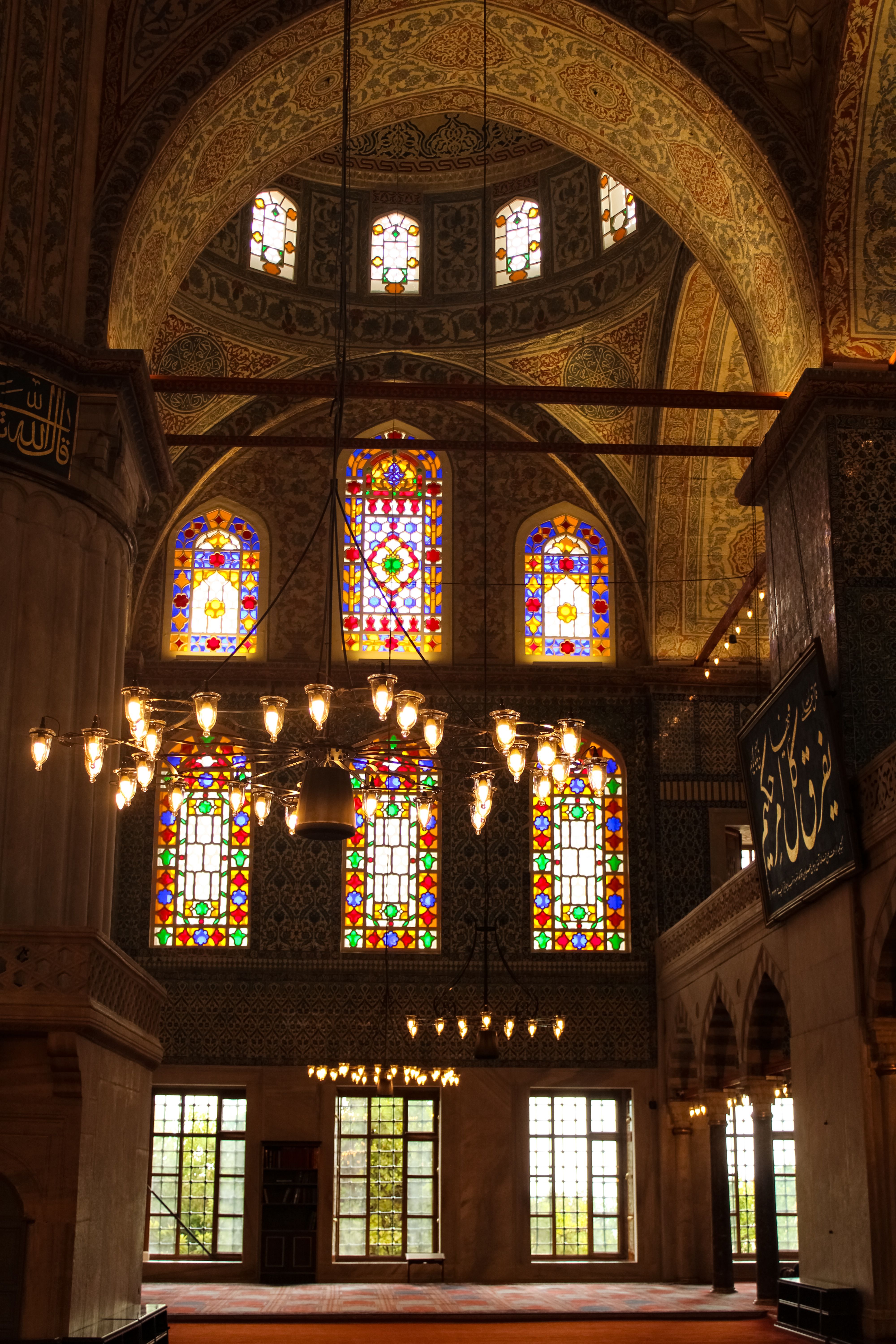 The interior of a mosque with stained glass windows · Free Stock Photo