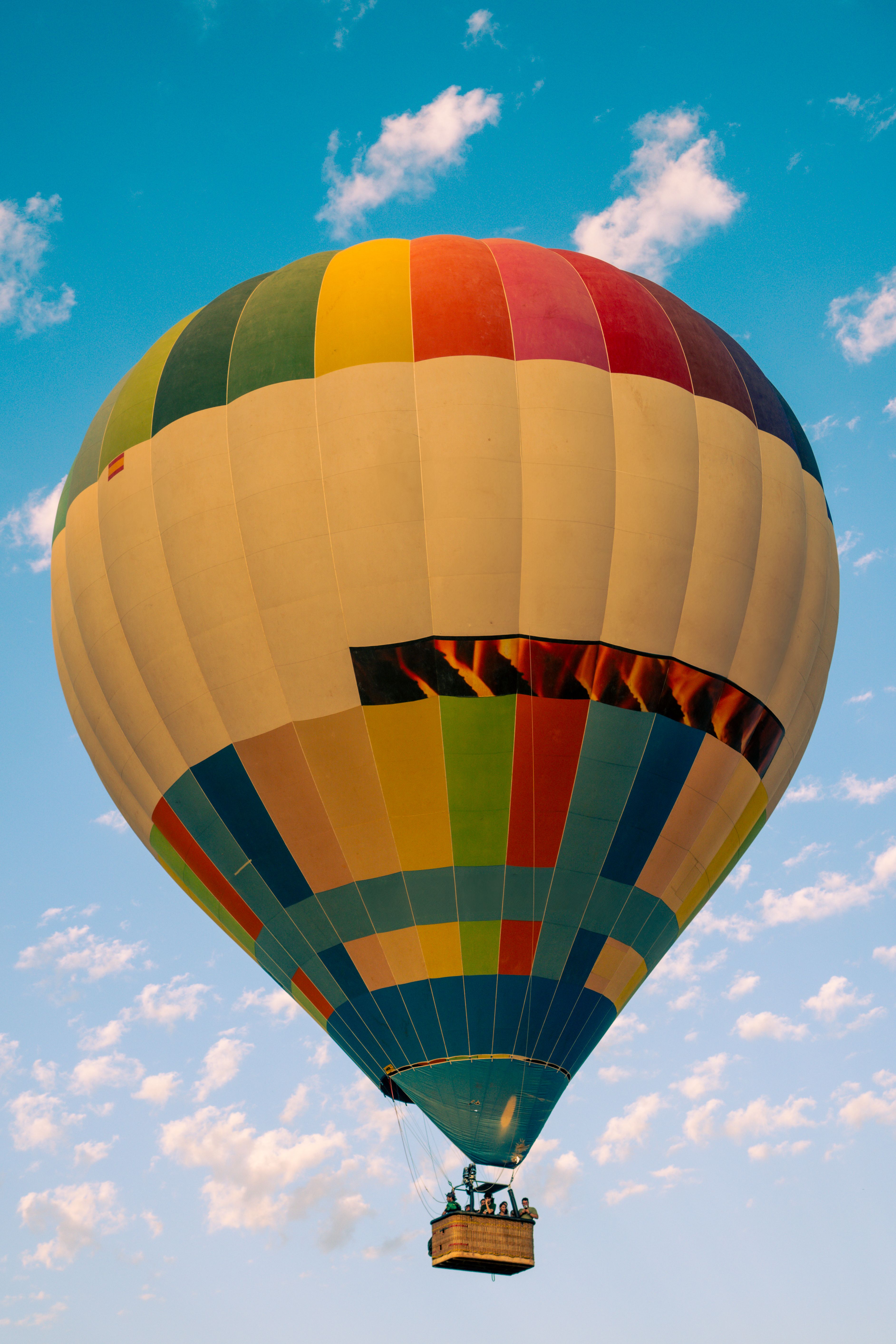 A colorful hot air balloon flying in the sky · Free Stock Photo
