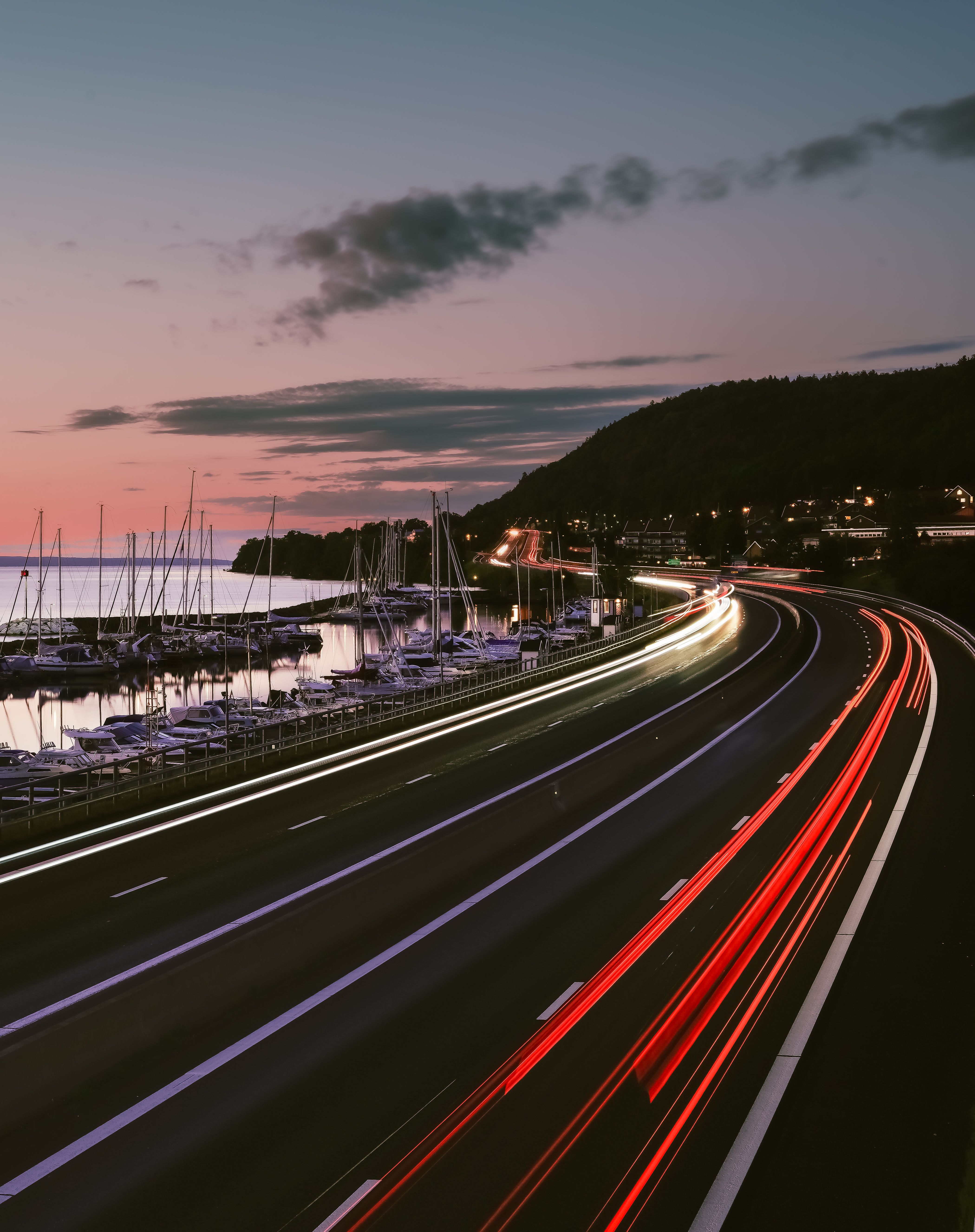 A long exposure photograph of a highway with boats · Free Stock Photo