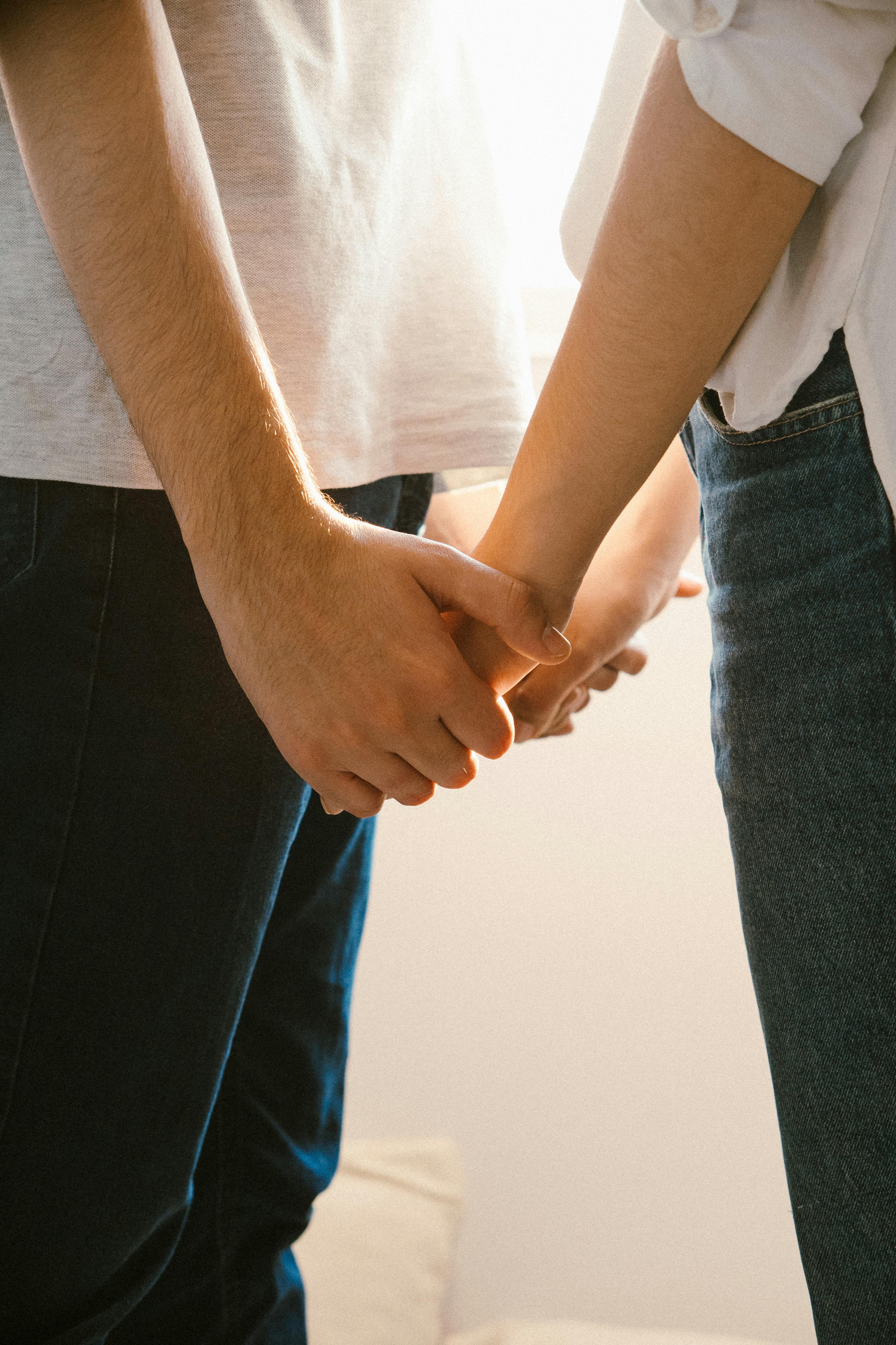 Man's Hand on a Woman's leg · Free Stock Photo