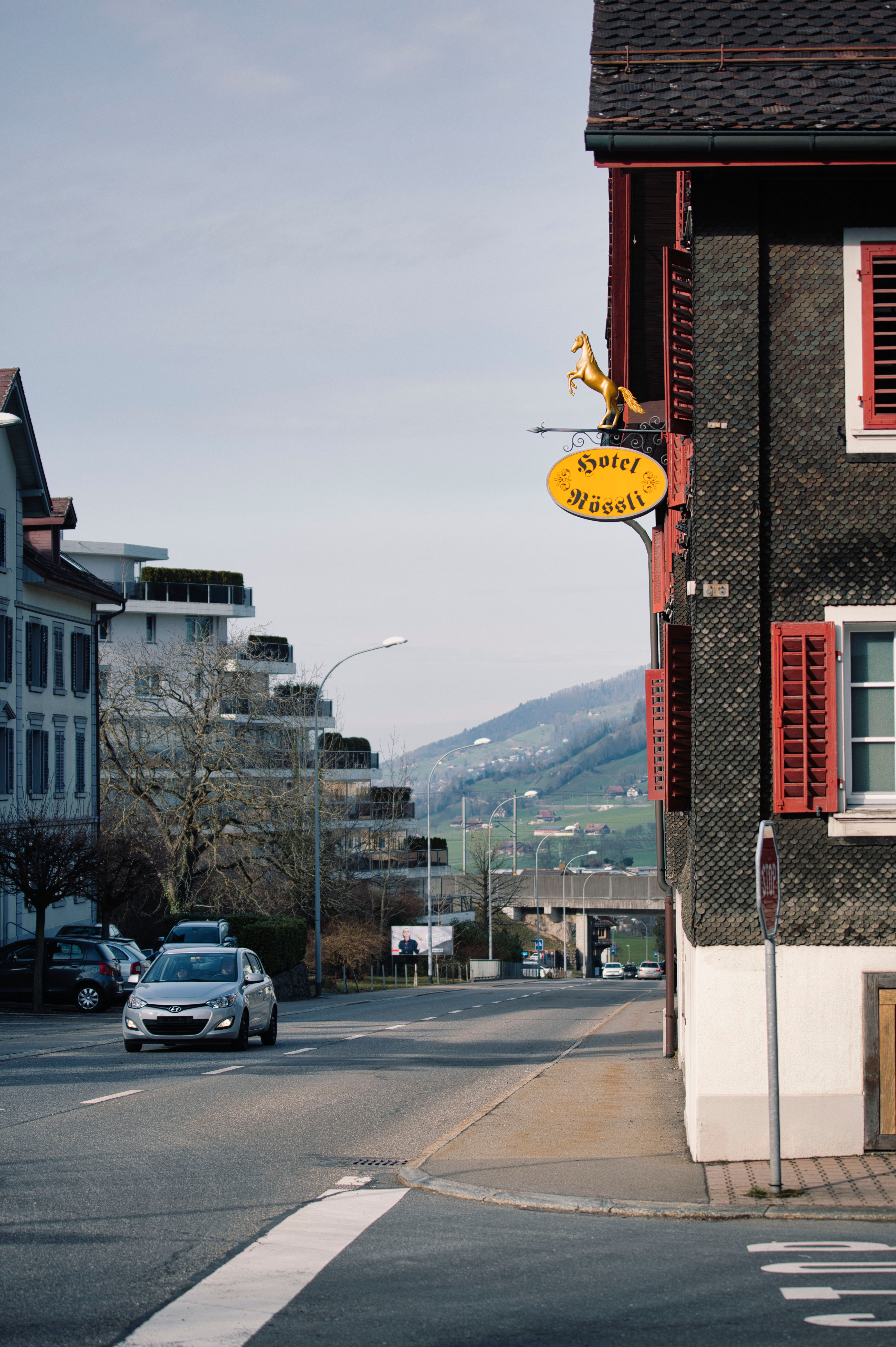 A street with a yellow sign on it · Free Stock Photo