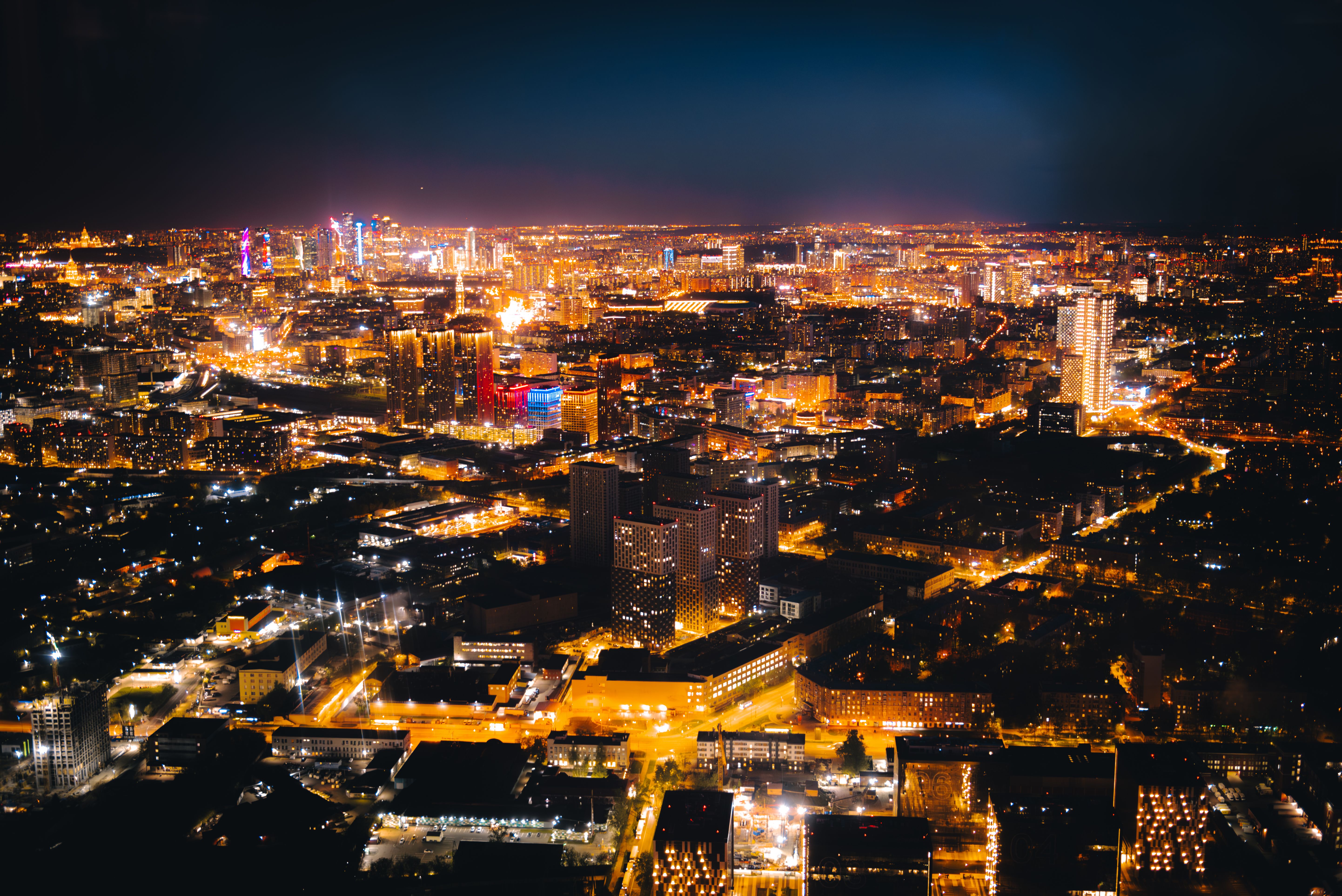 A city at night with lights and buildings · Free Stock Photo