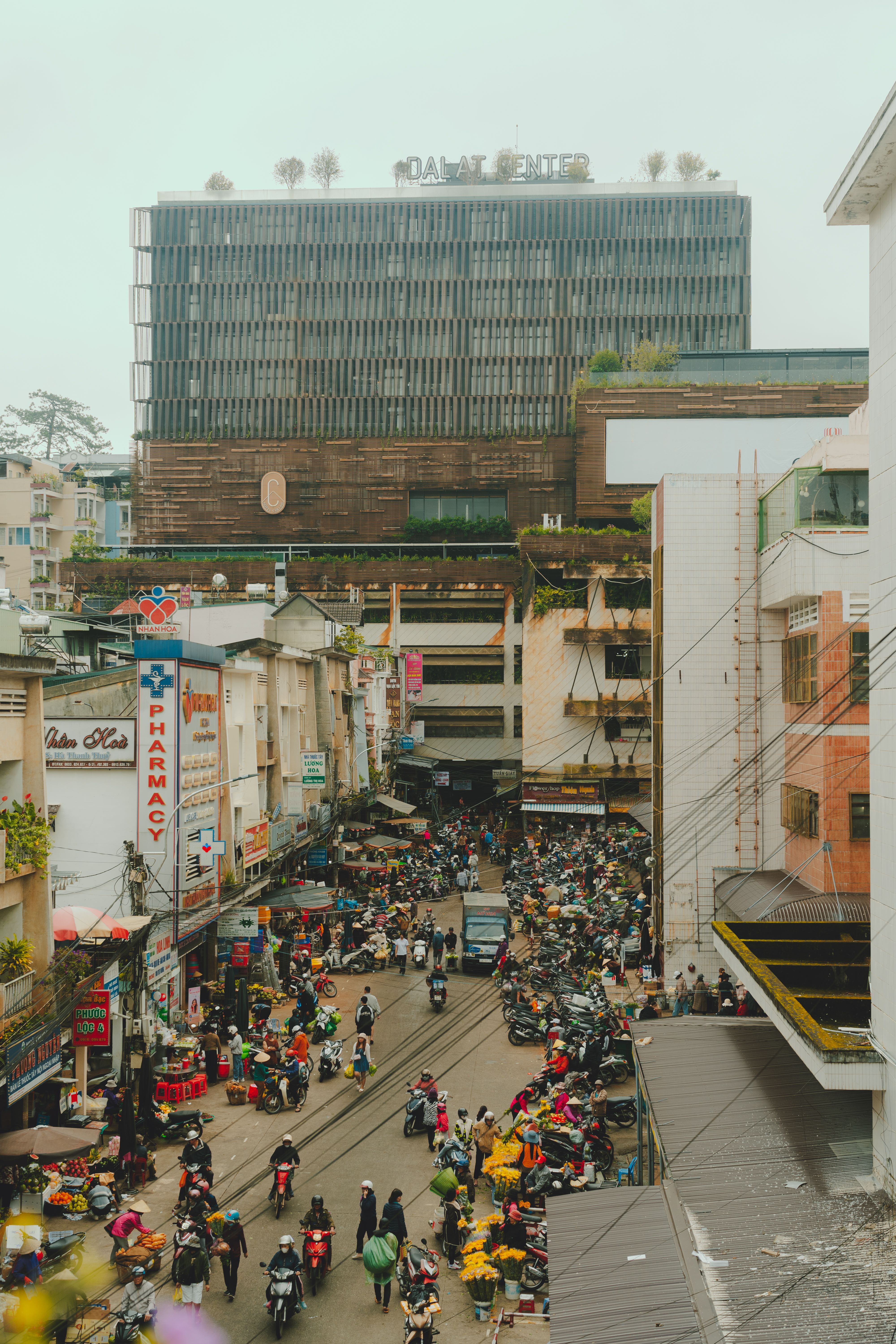 Gray Asphalt Street in Between Yellow and White Concrete Buildings at ...