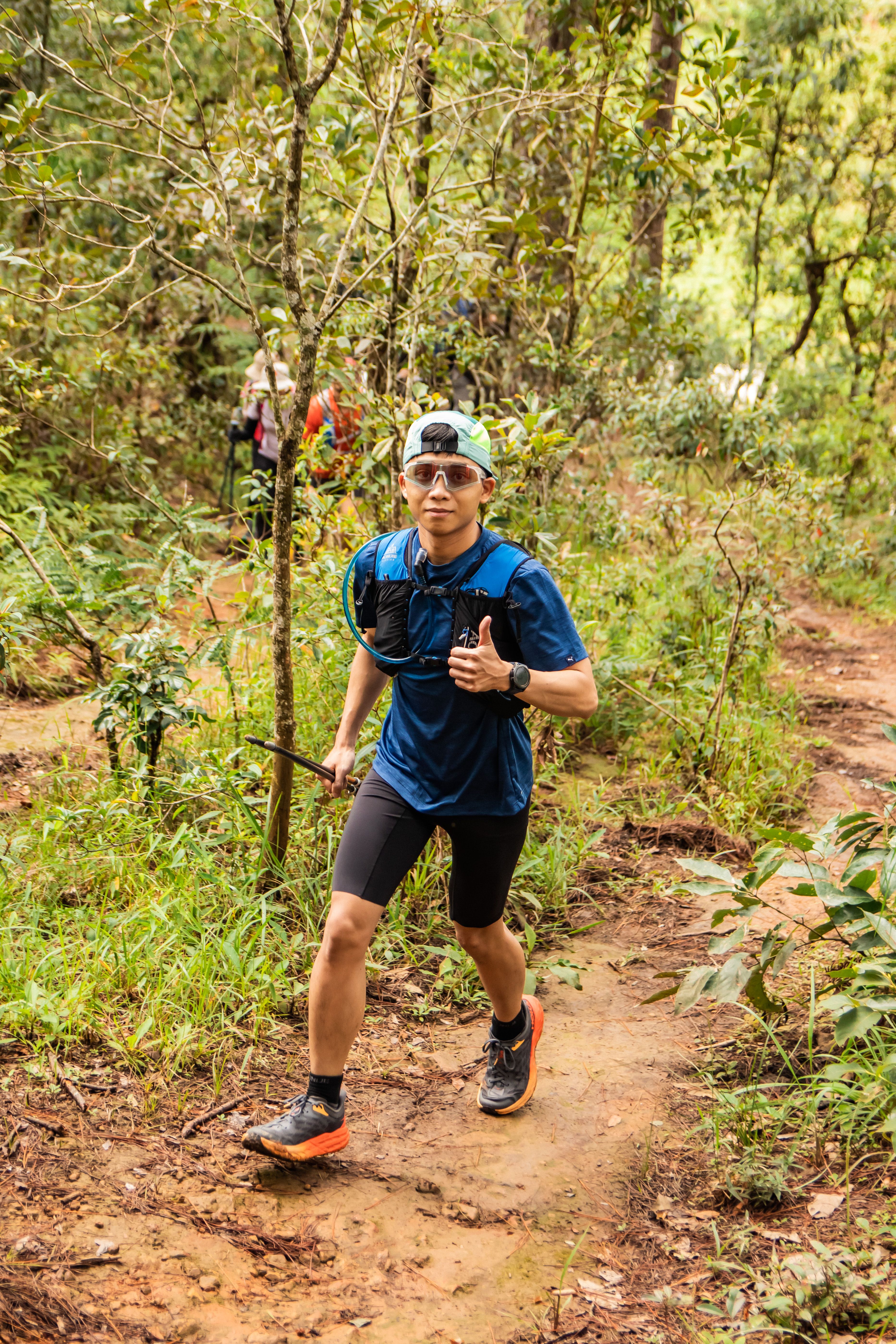A man running on a trail in the woods · Free Stock Photo