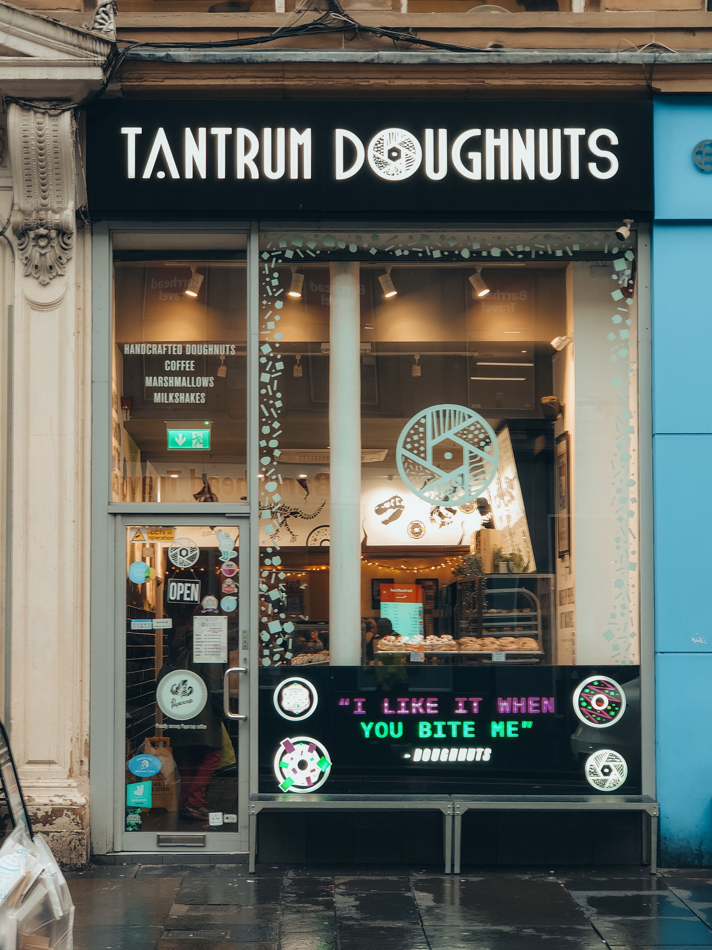 A storefront with a sign that says tantrum doughnuts · Free Stock Photo