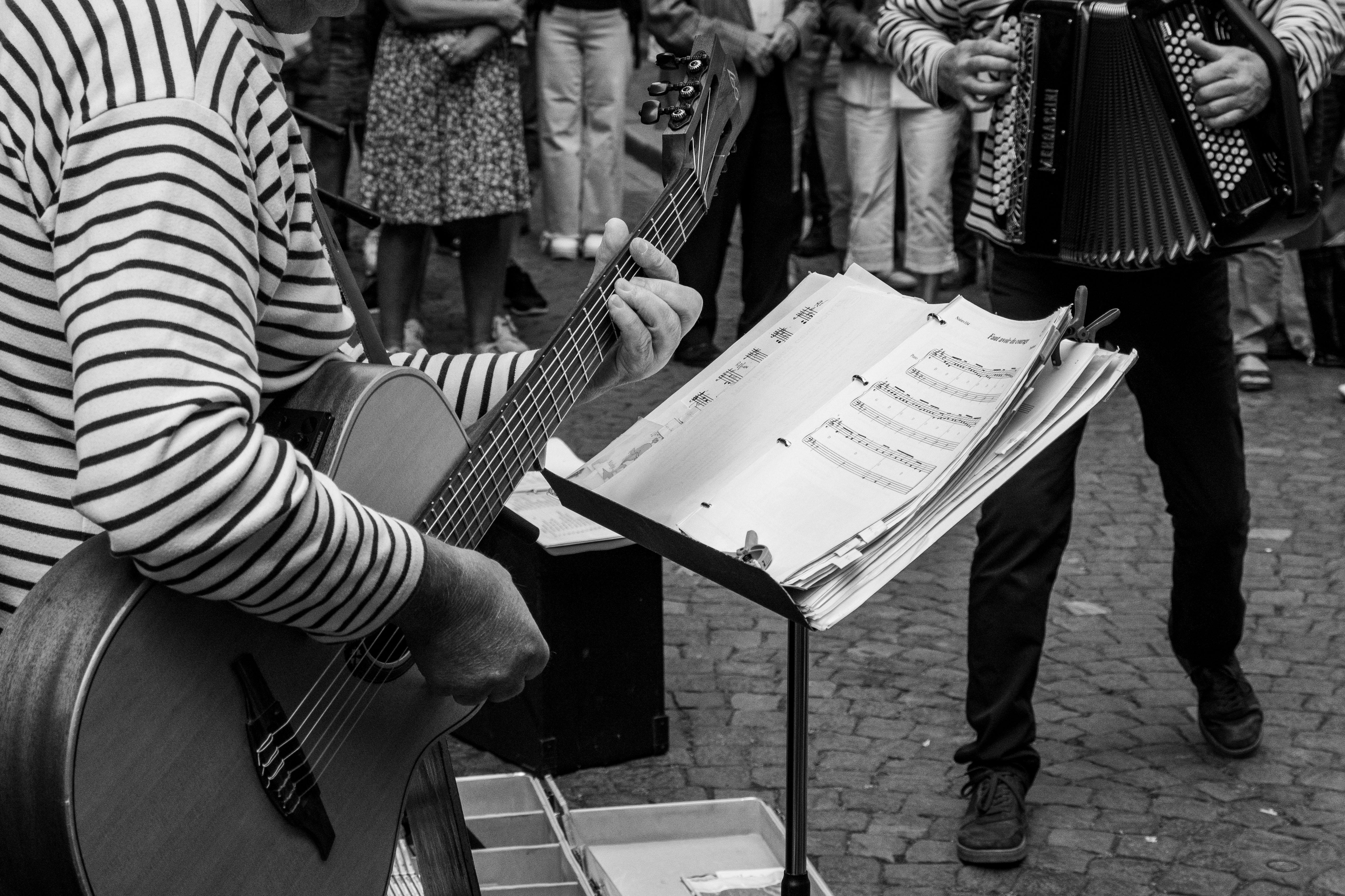 Greyscale Photography of Man and Woman Playing Musical Instruments ...