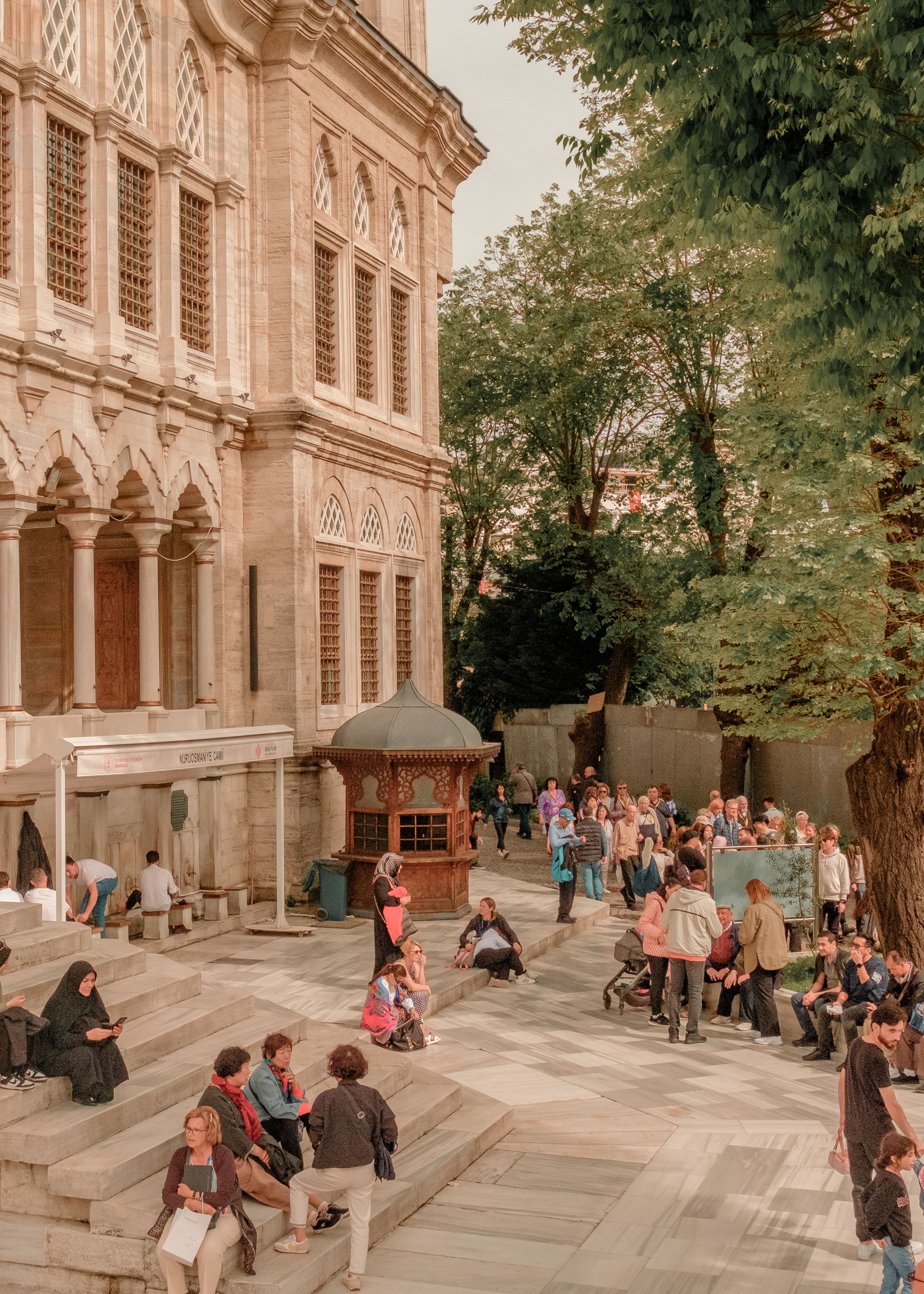 People sitting on steps in front of a building · Free Stock Photo