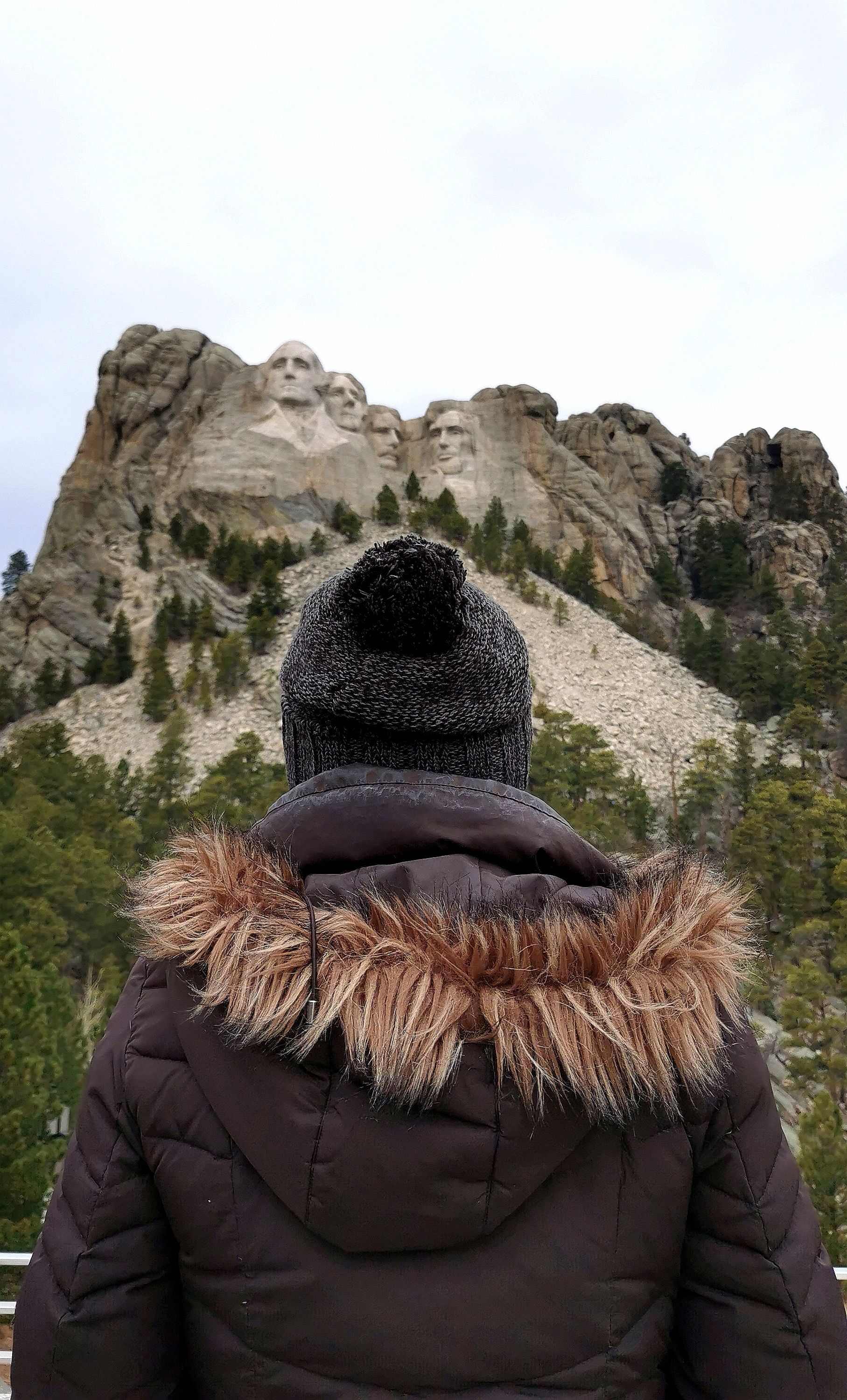 person in wooly hat and Jack staring up at Mount Rushmore on a cold day (Heads Up!) · Free Stock ...