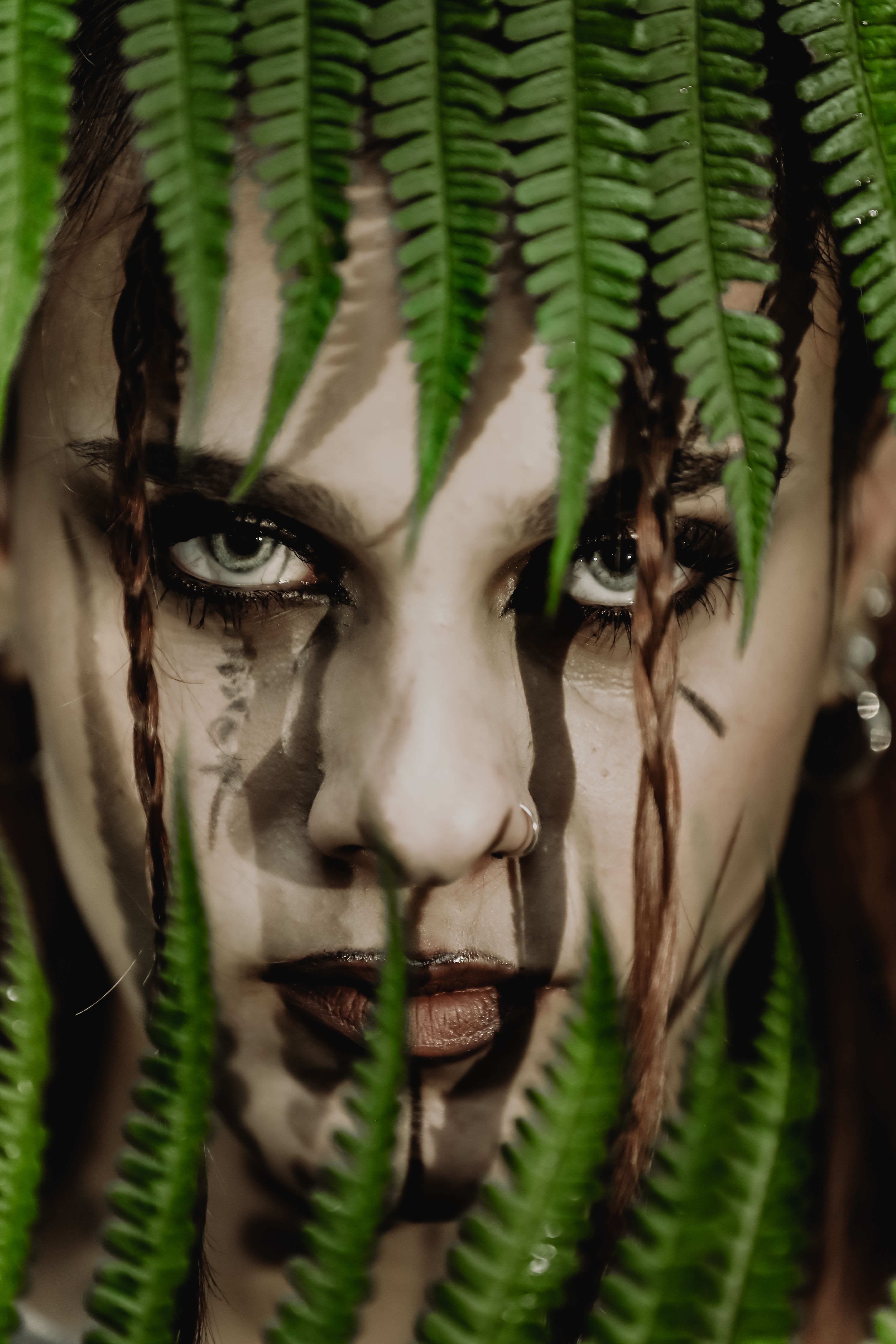 A woman with fern leaves in her hair · Free Stock Photo