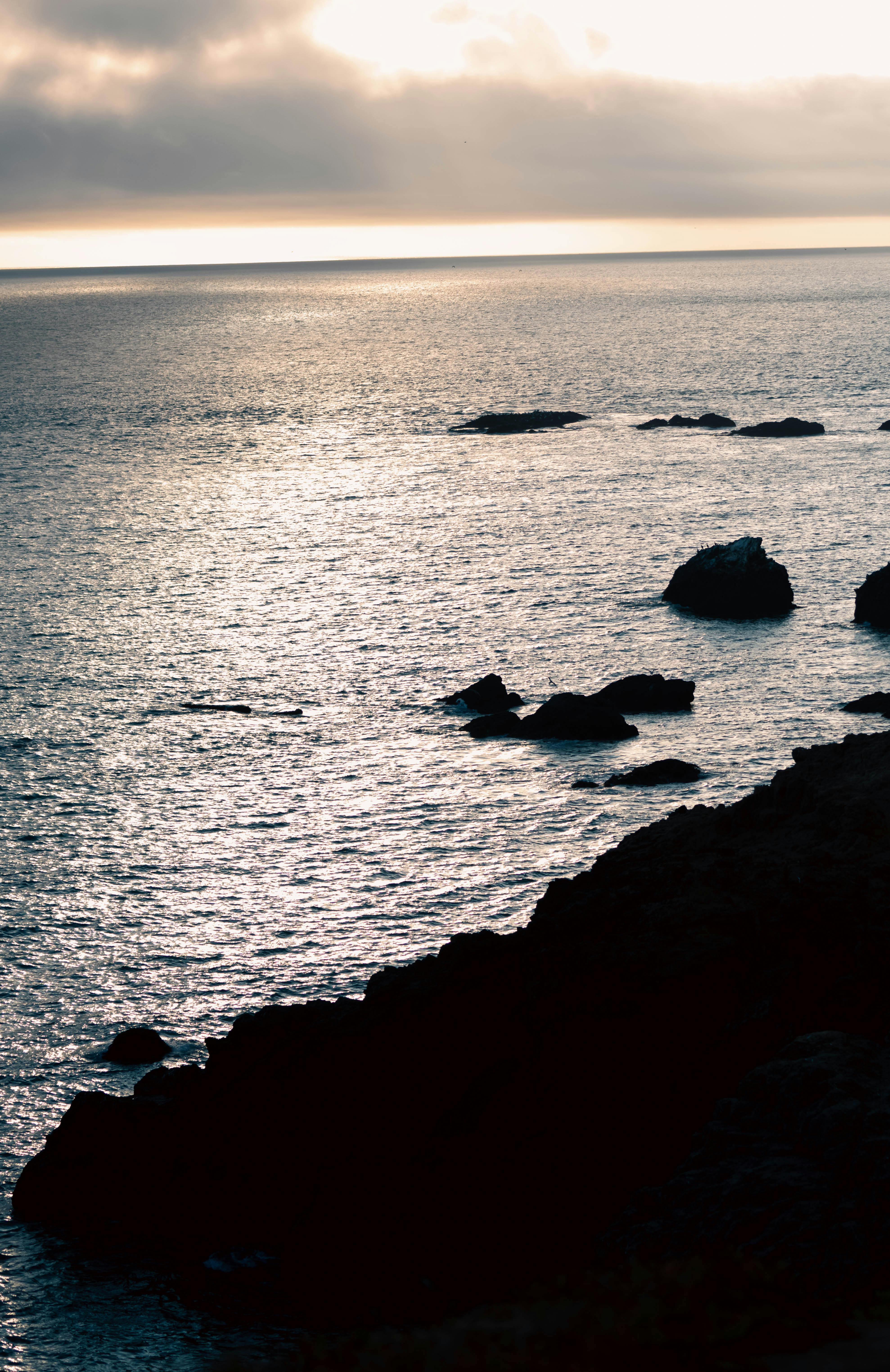 Gray Sand Beach during Sunset · Free Stock Photo