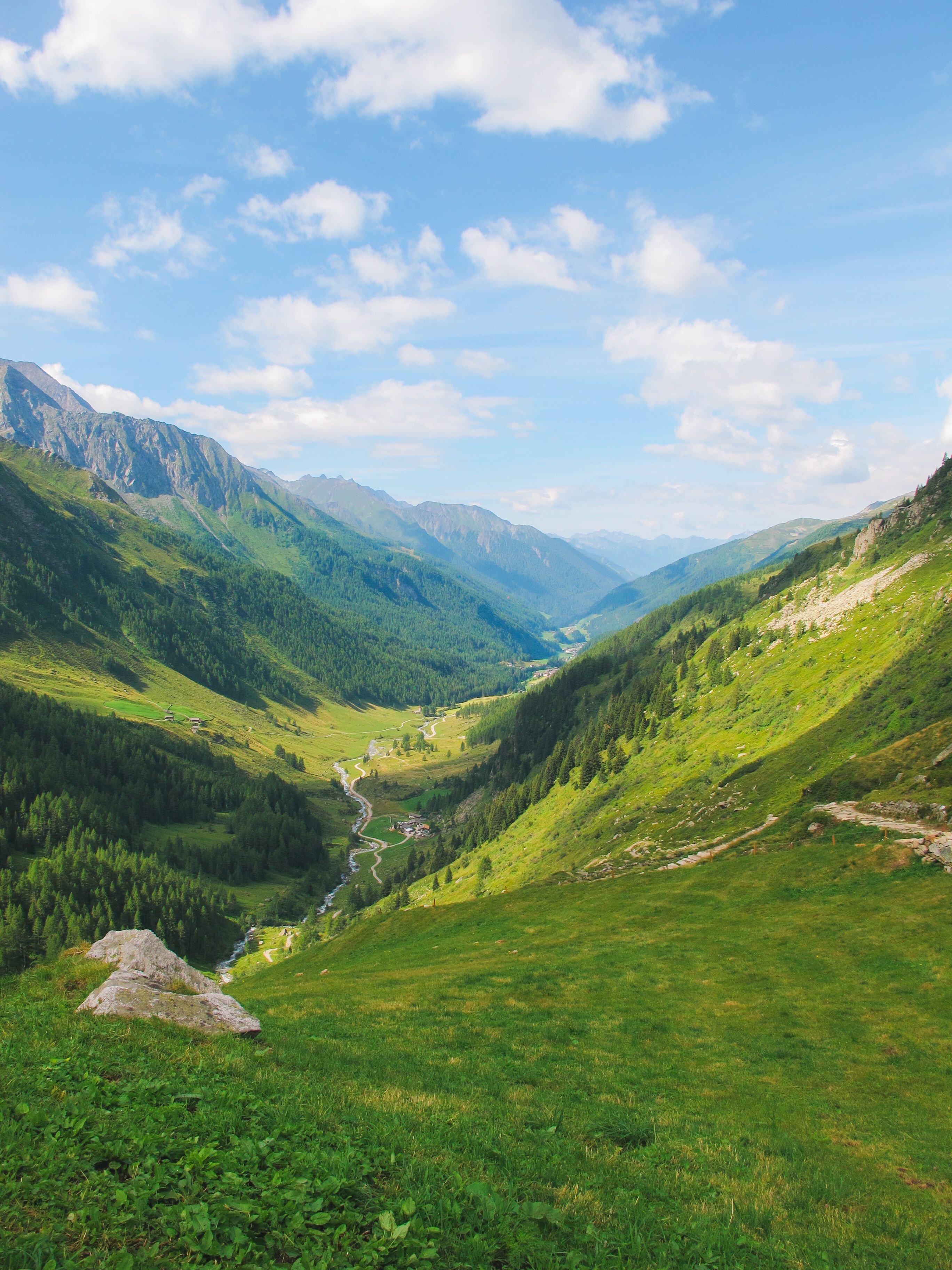 A valley with mountains and grassy hills · Free Stock Photo