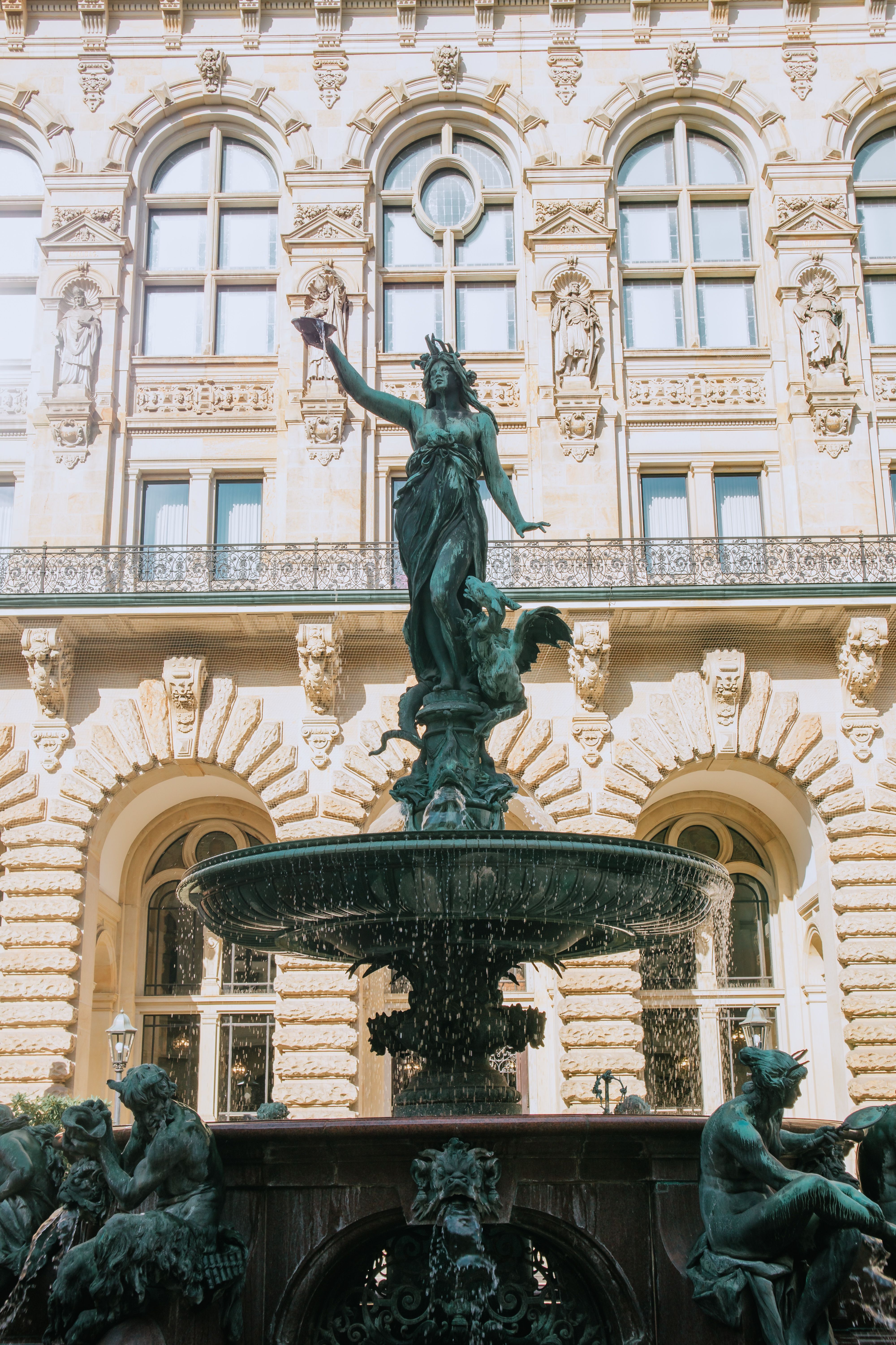 Red Rose Placed on Female Water Fountain Statue's Hand · Free Stock Photo