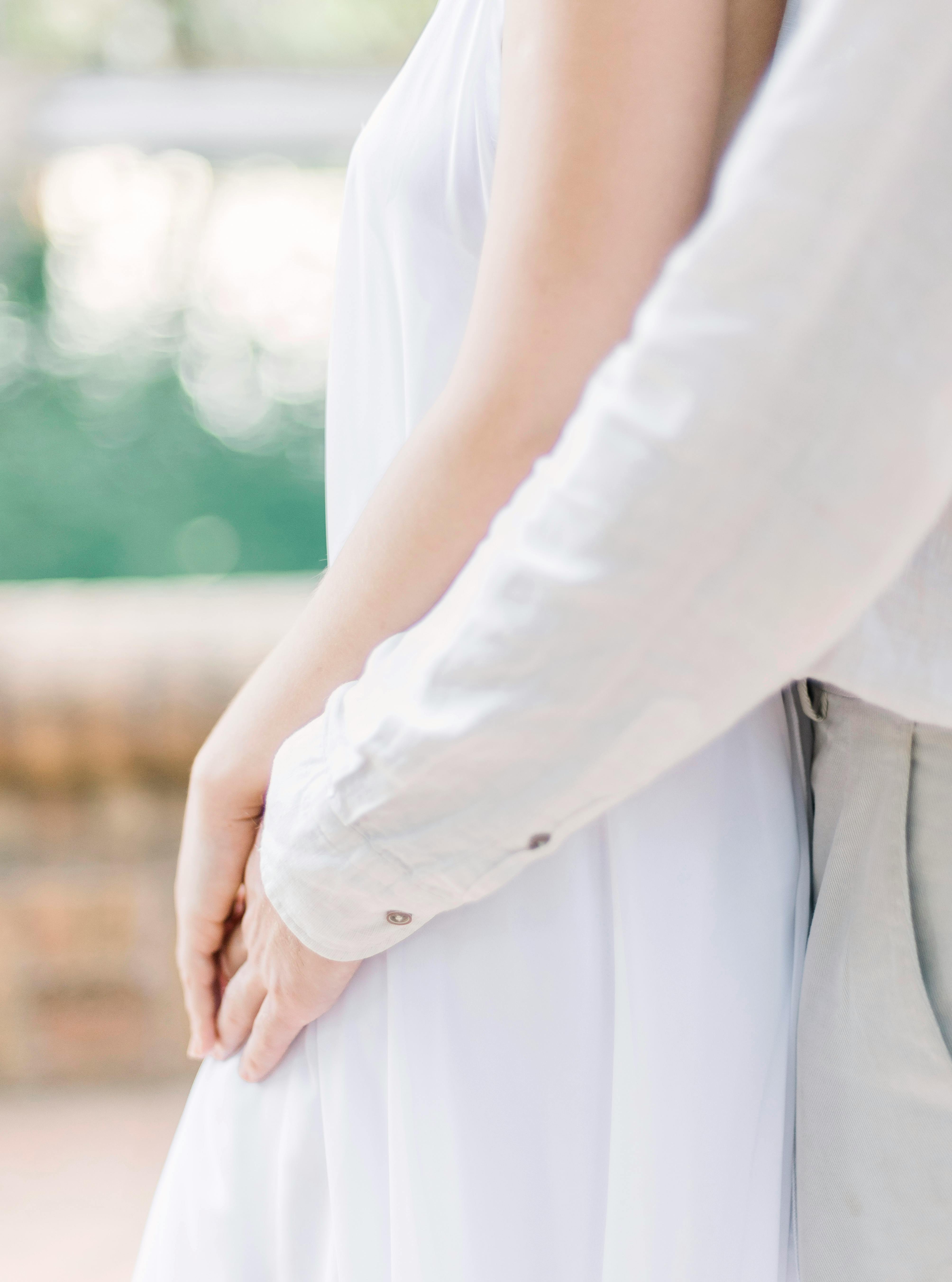 Arms of Woman and Man Hugging · Free Stock Photo