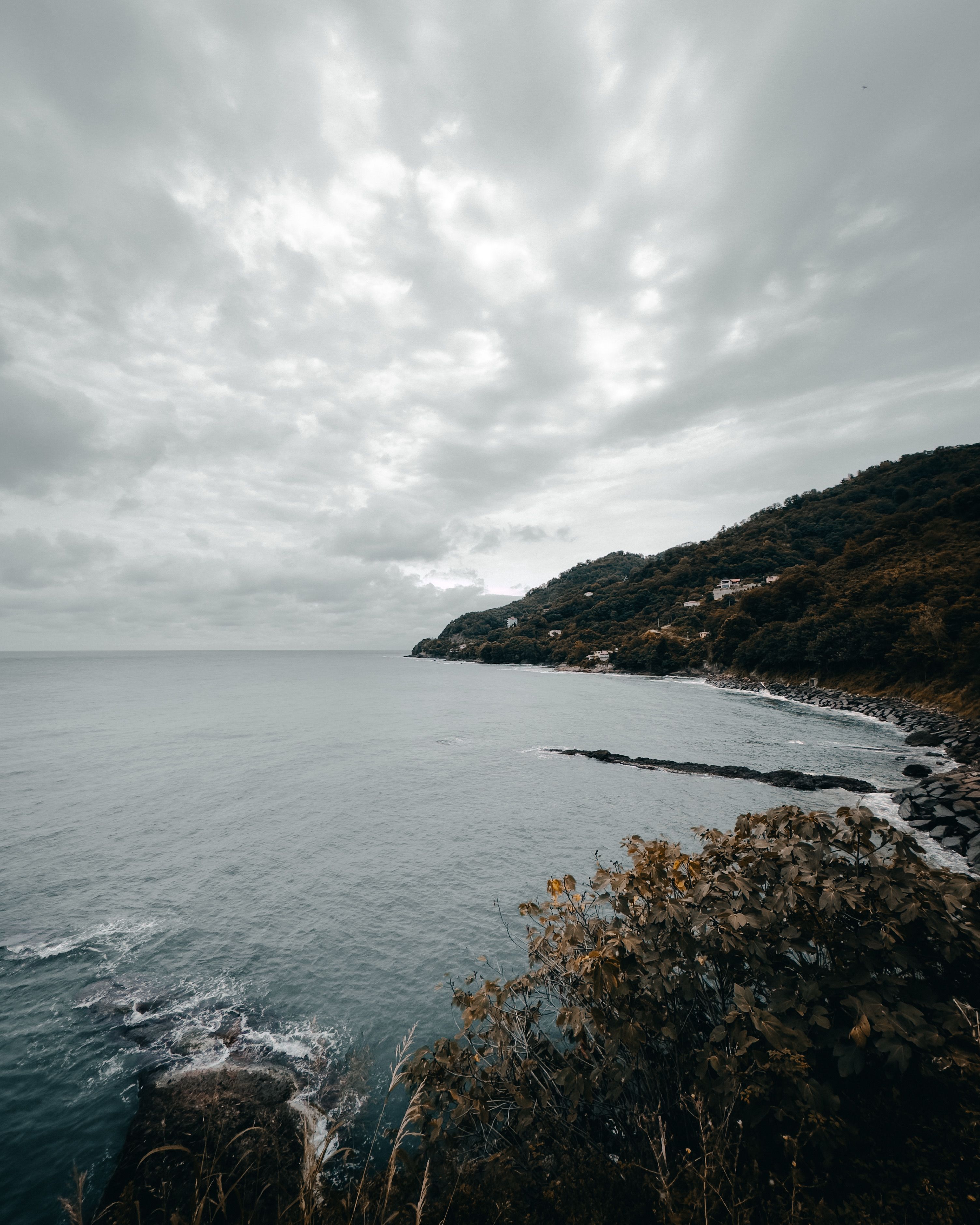 A photo of the ocean with clouds over it · Free Stock Photo