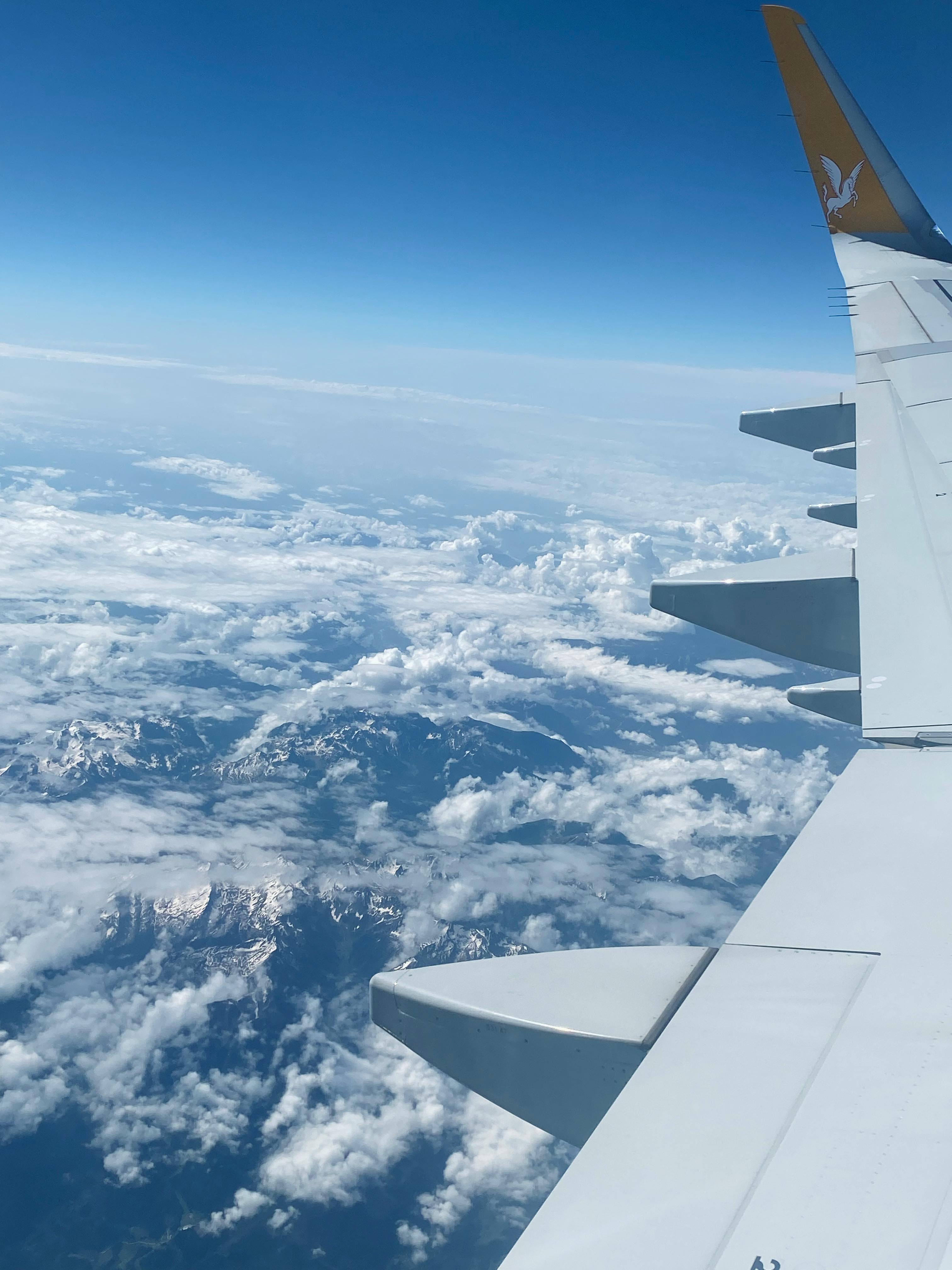 White and Red Blimp Flying · Free Stock Photo