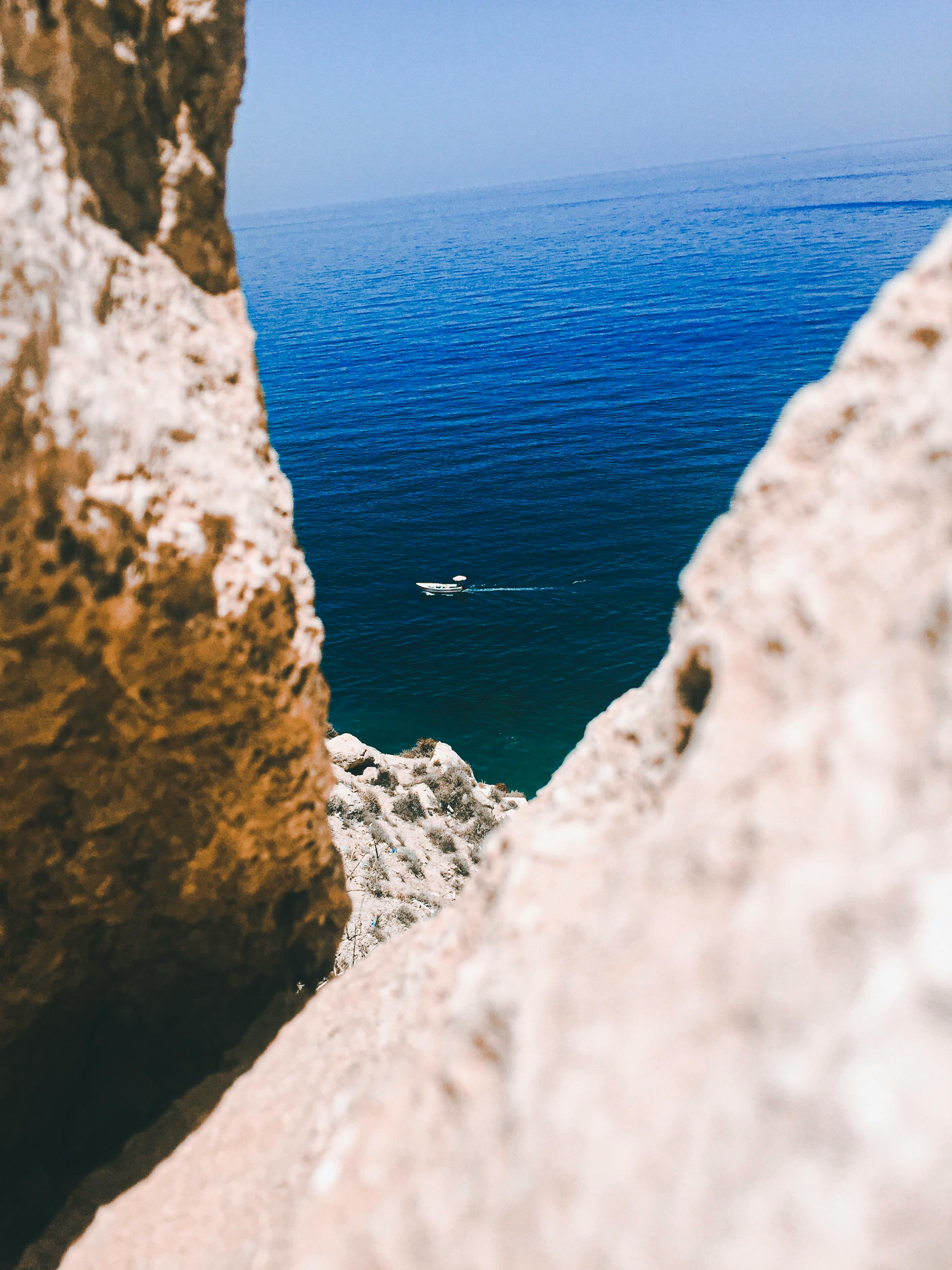 2 Green-and-gray Islet on Body of Water · Free Stock Photo