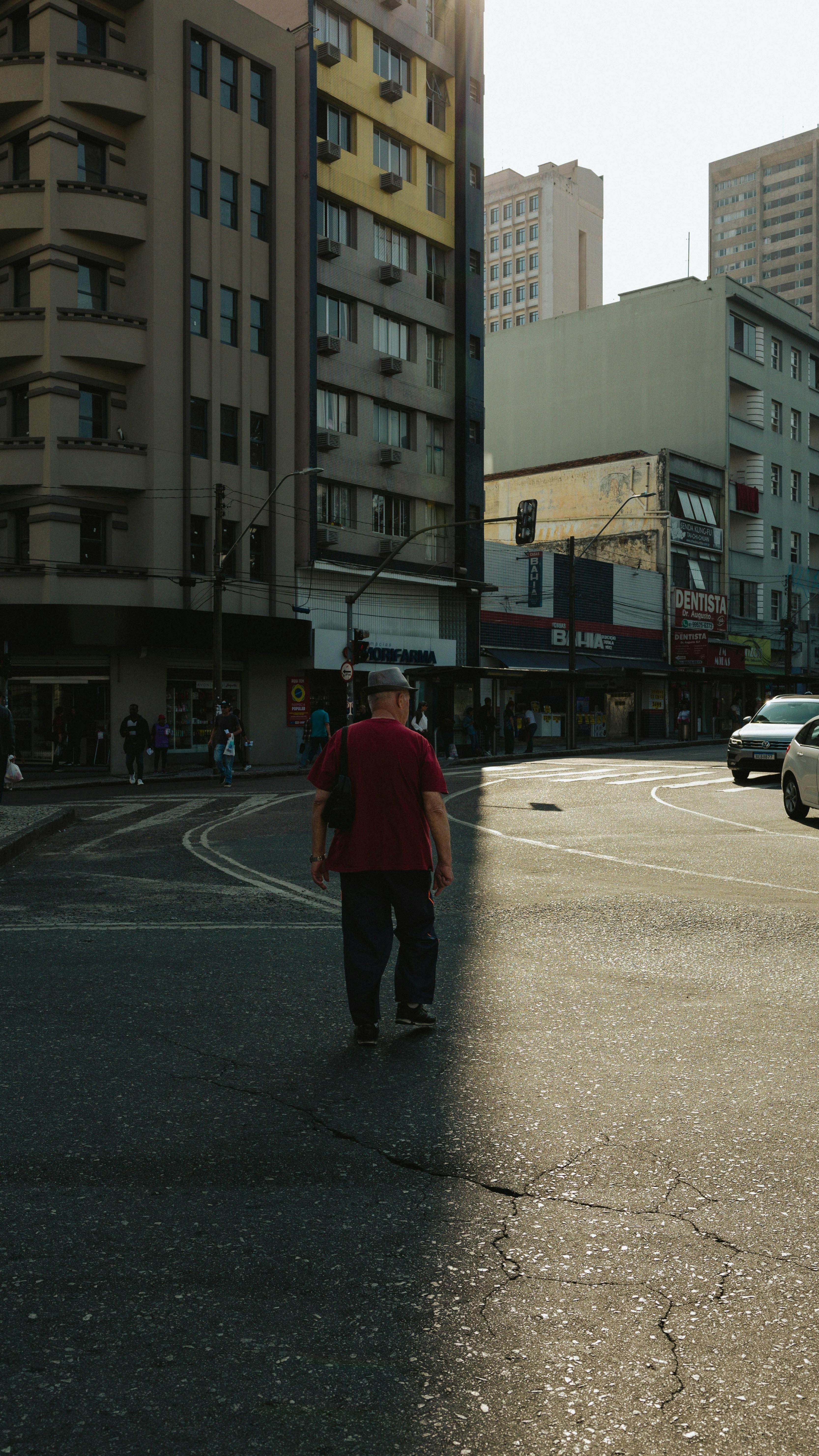 Man Jaywalking in City · Free Stock Photo