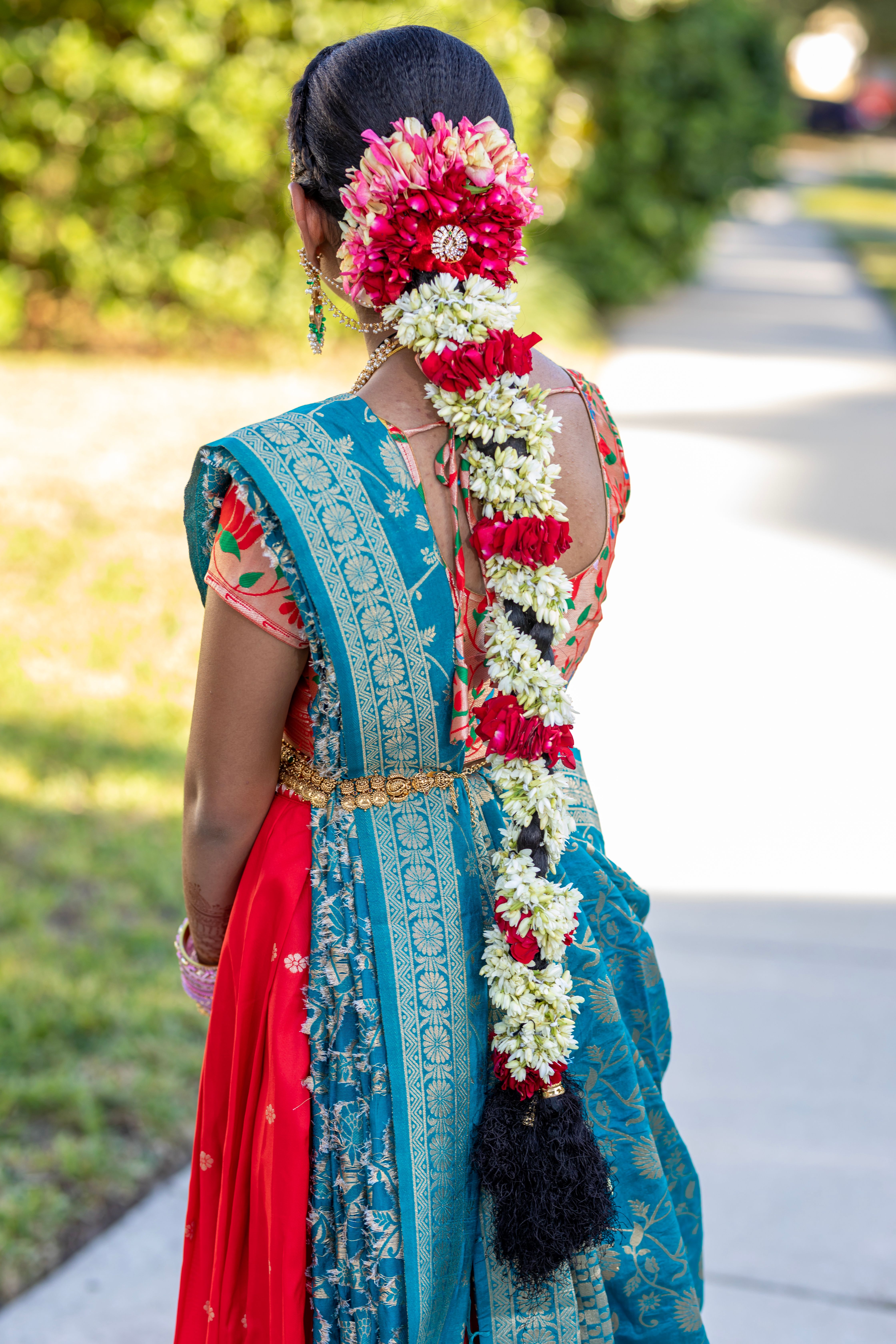 A woman in a sari with a flower in her hair · Free Stock Photo