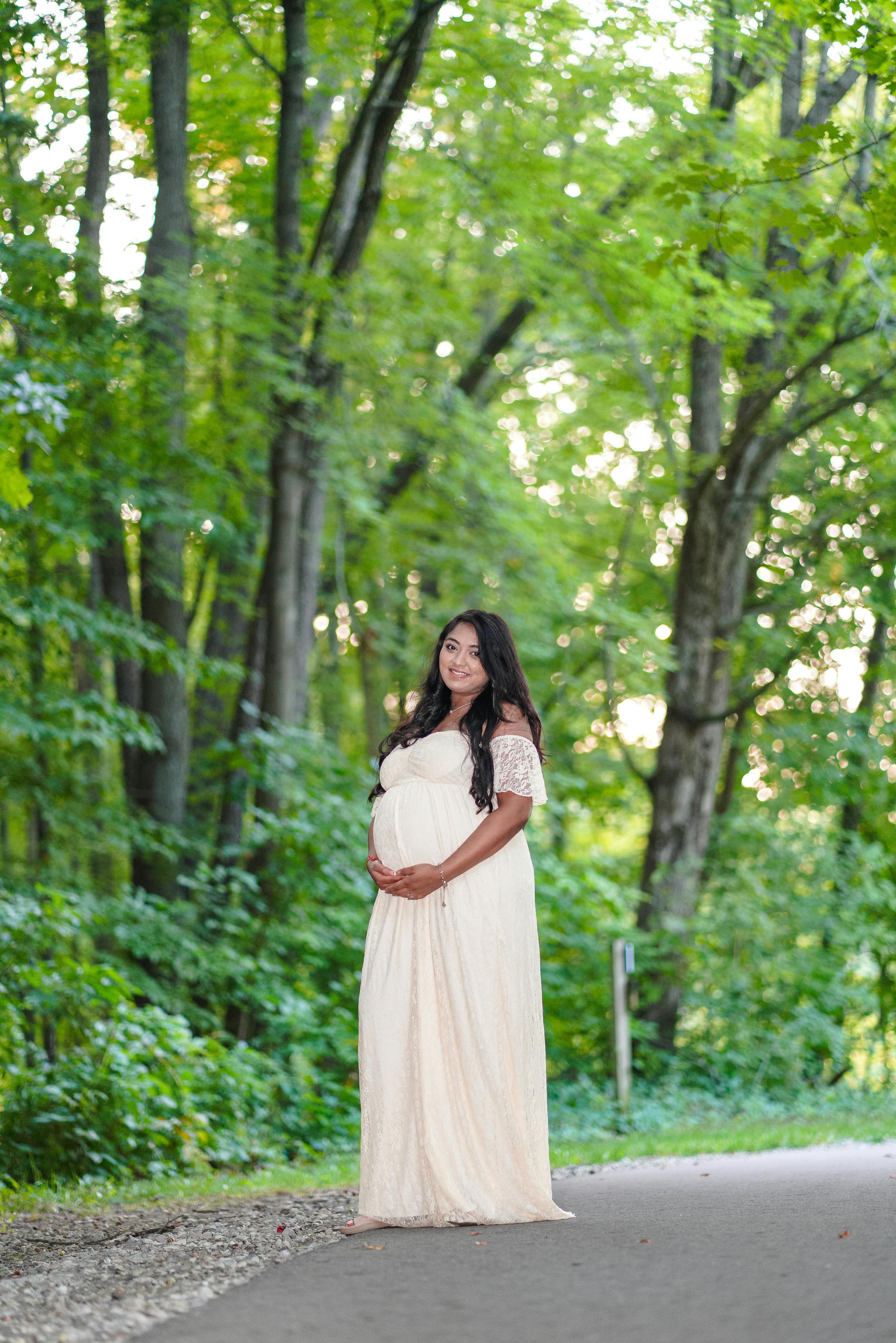 Outdoor Maternity Portrait in Lush Forest Setting · Free Stock Photo