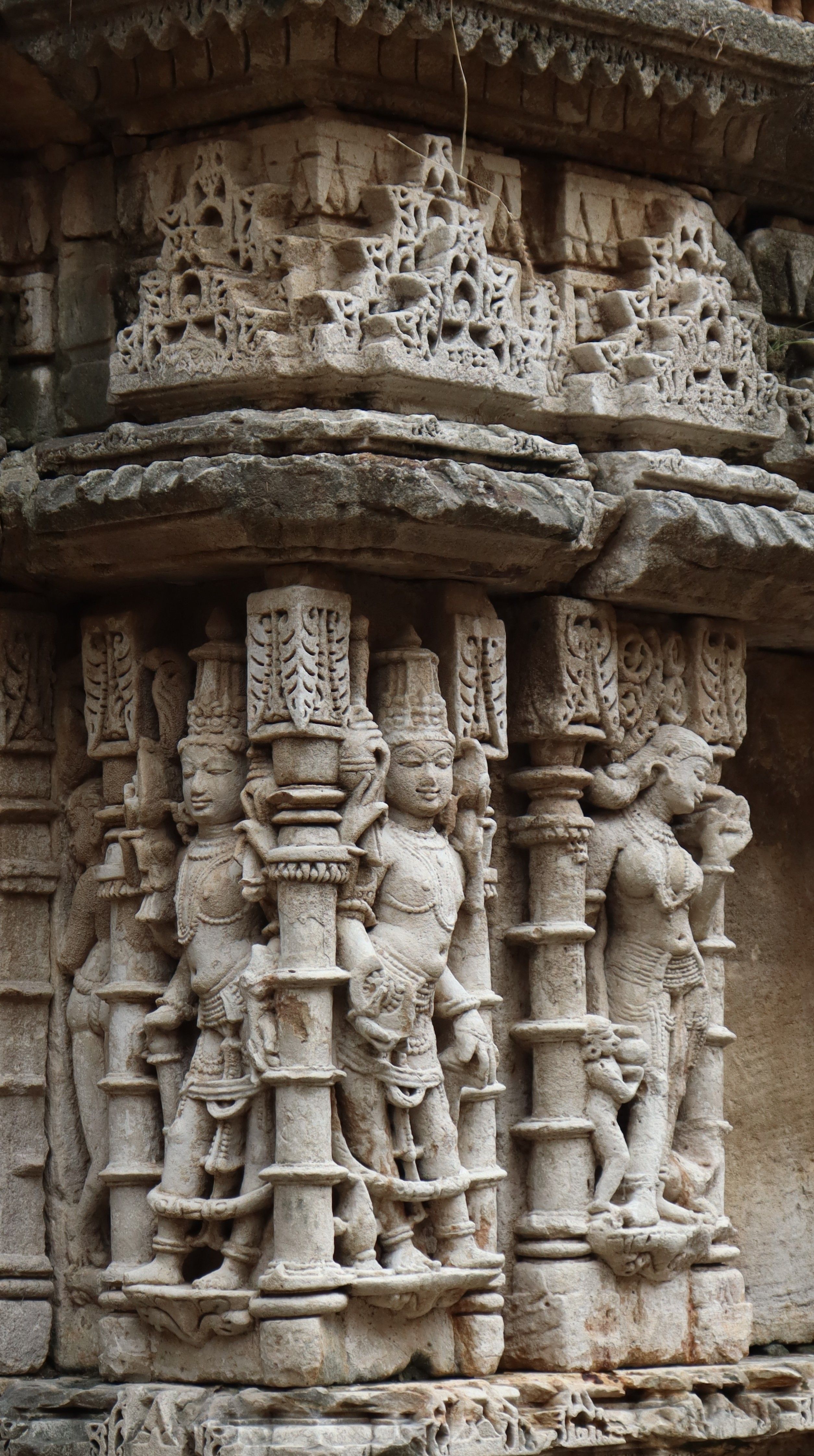 A stone carving of a group of people on a wall · Free Stock Photo