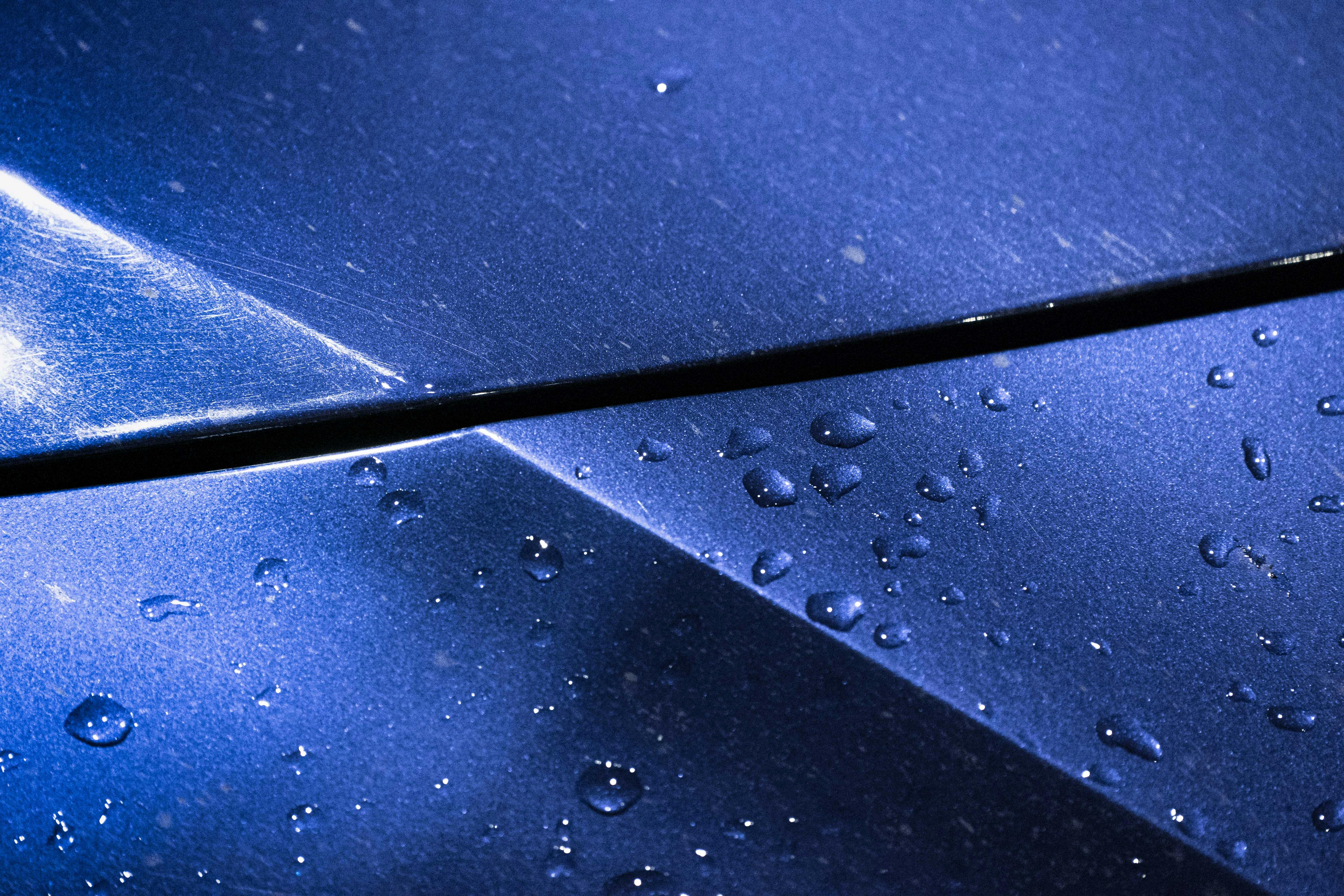 Water Drops on Dark Surface · Free Stock Photo