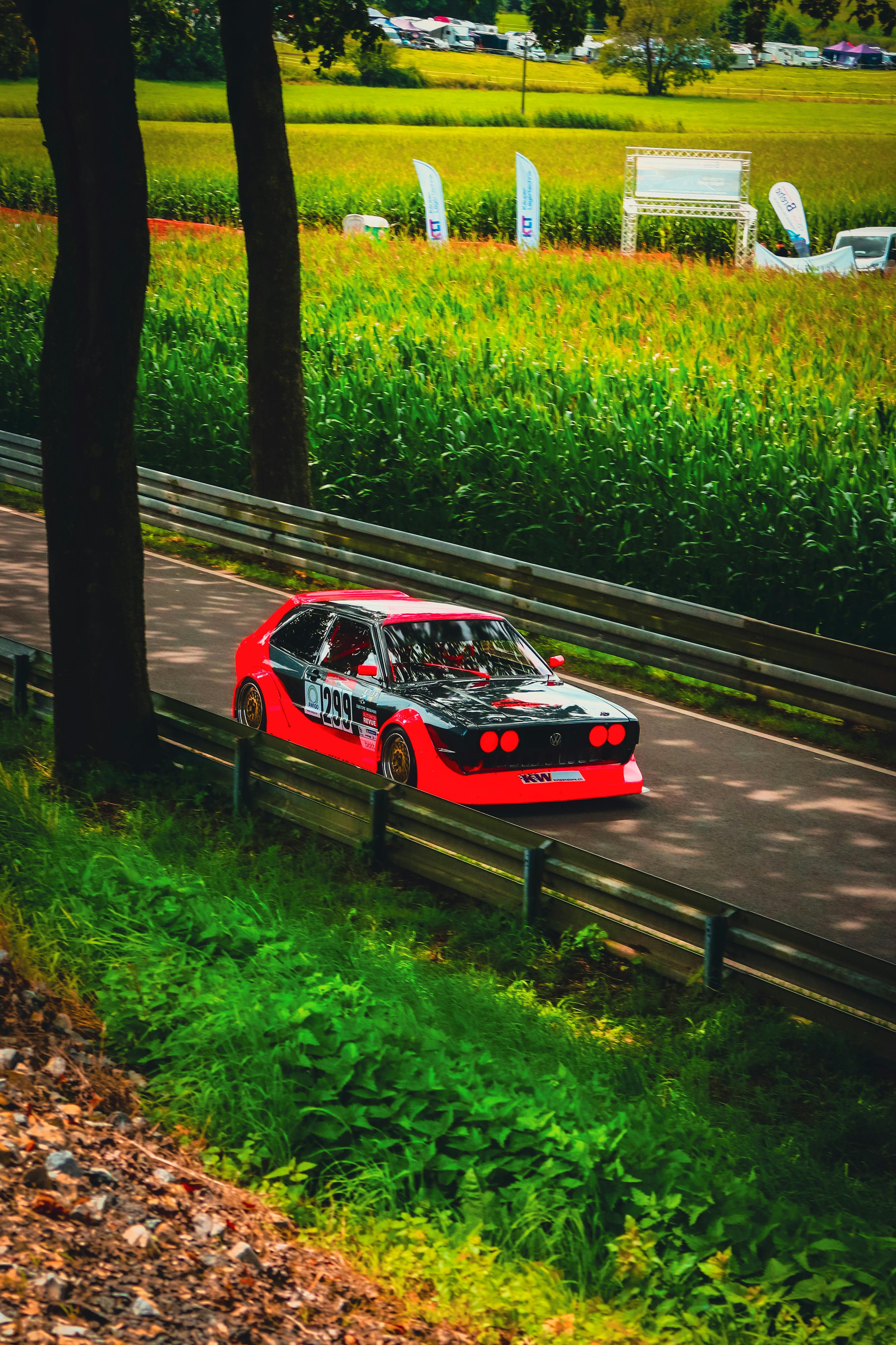 Rally Car on Road between Fields · Free Stock Photo