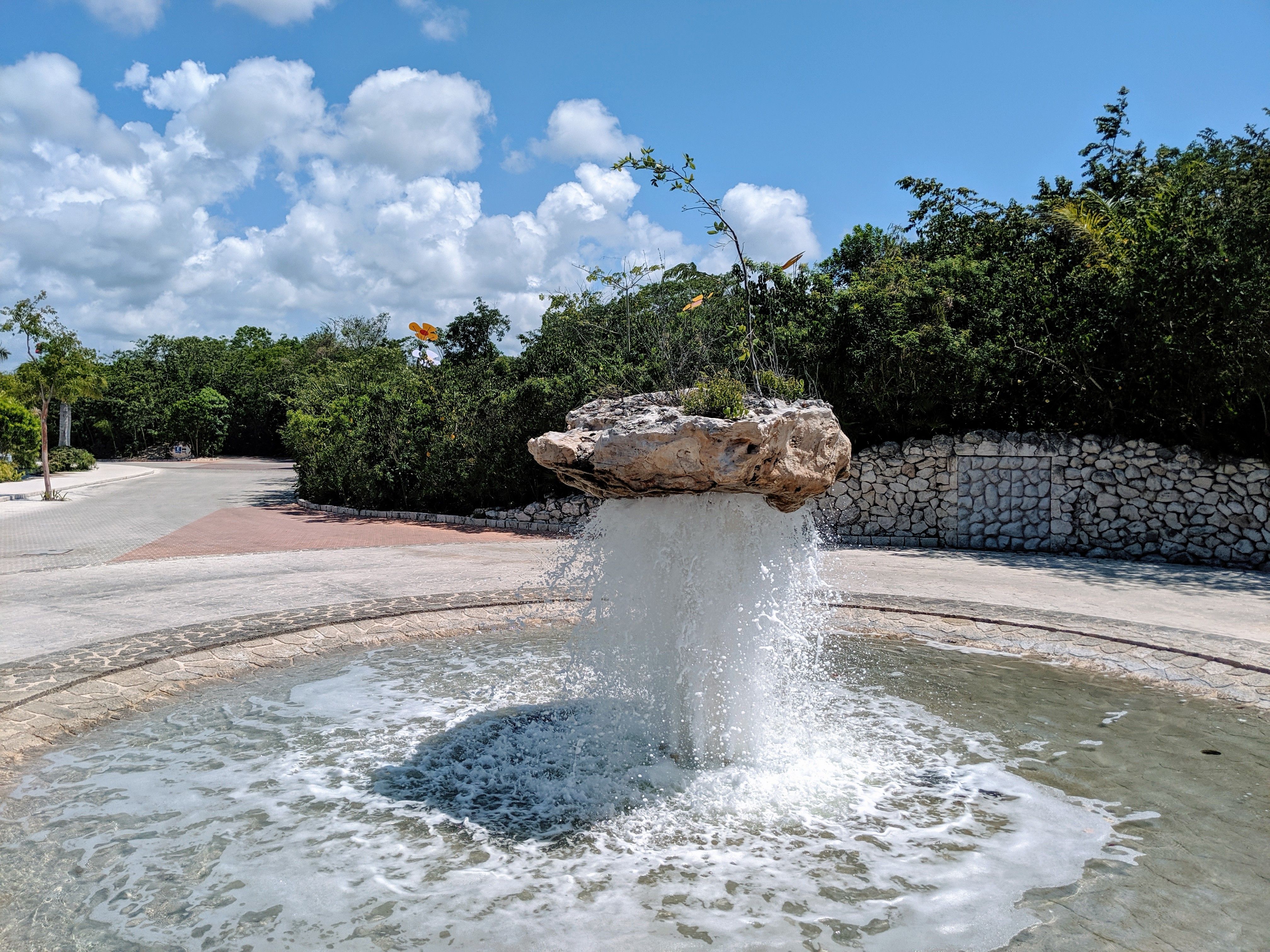 A fountain with water flowing out of it · Free Stock Photo