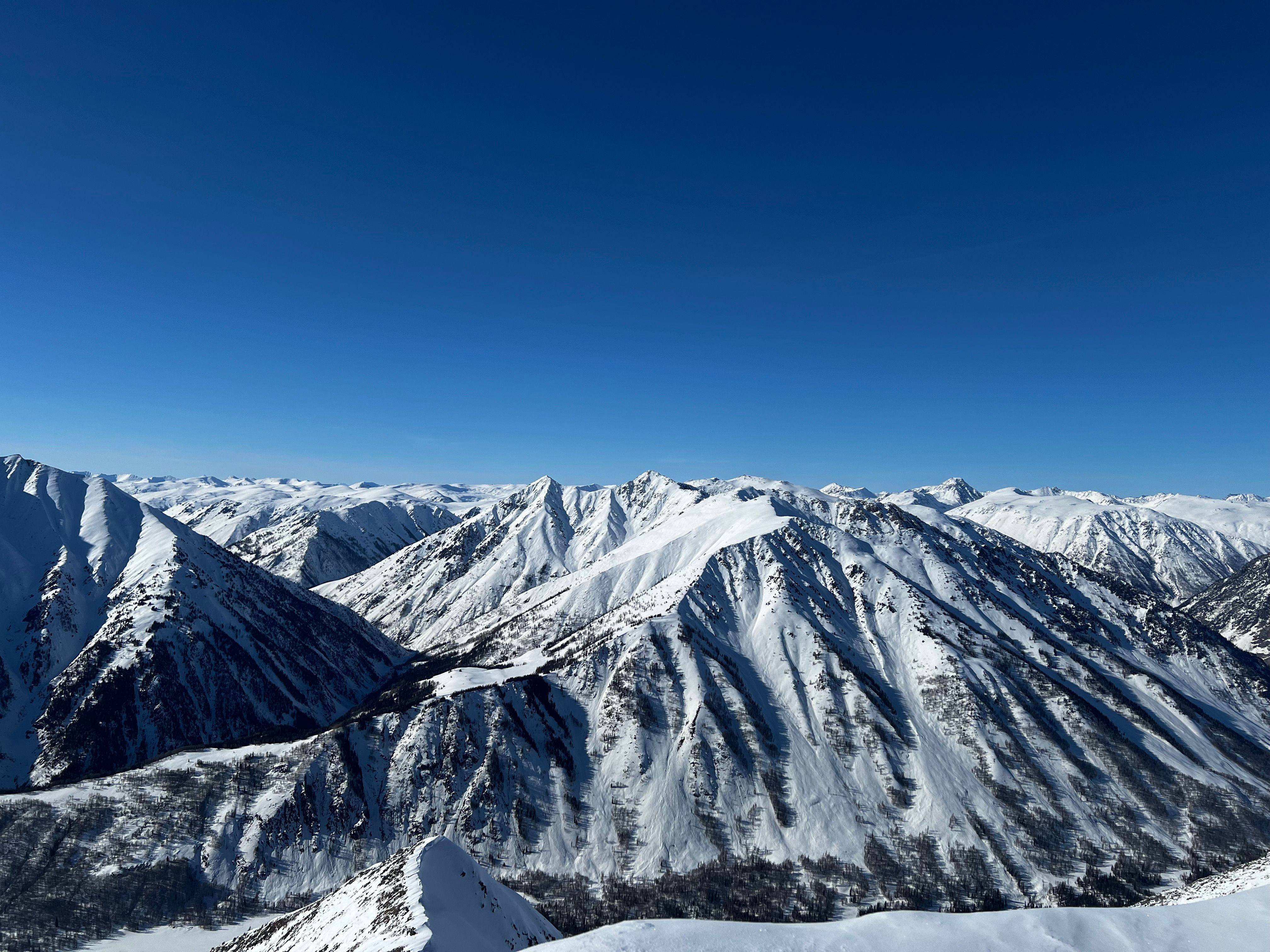 Aerial Photography Of Snowy Hill · Free Stock Photo