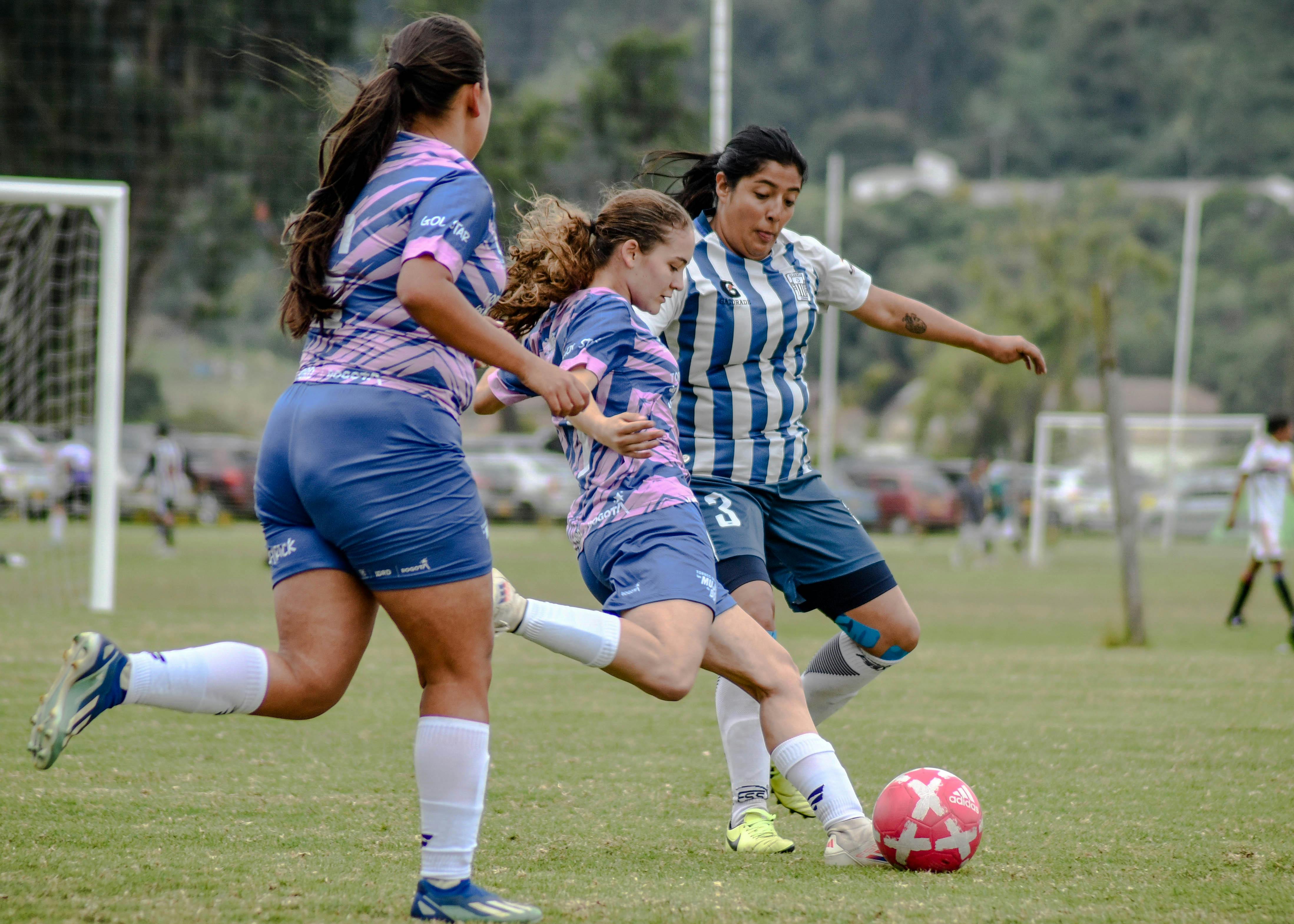 Energetic Women's Soccer Match Action Shot · Free Stock Photo