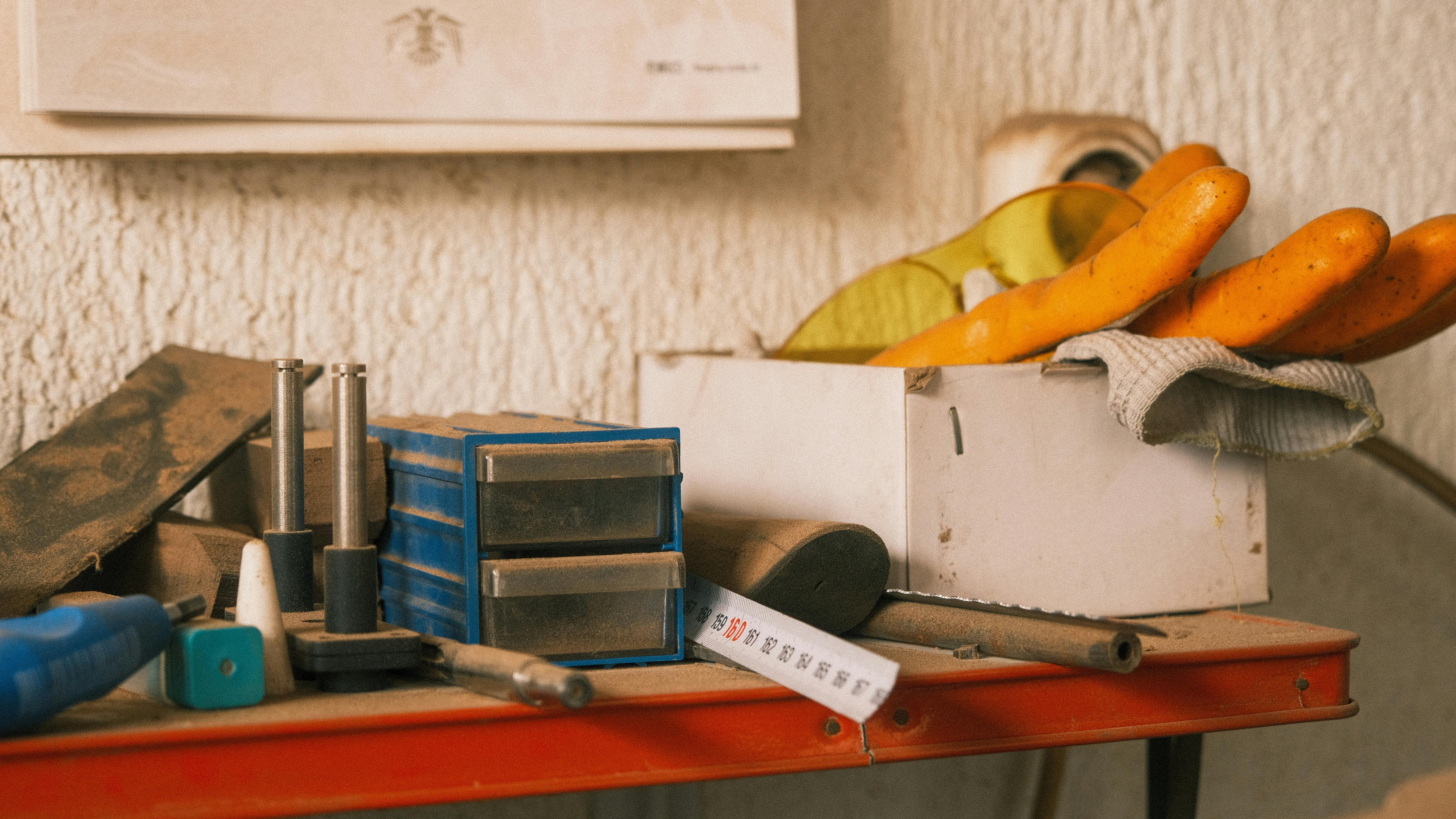 Close-up of Dusty Tools on a Shelf in a Workshop · Free Stock Photo