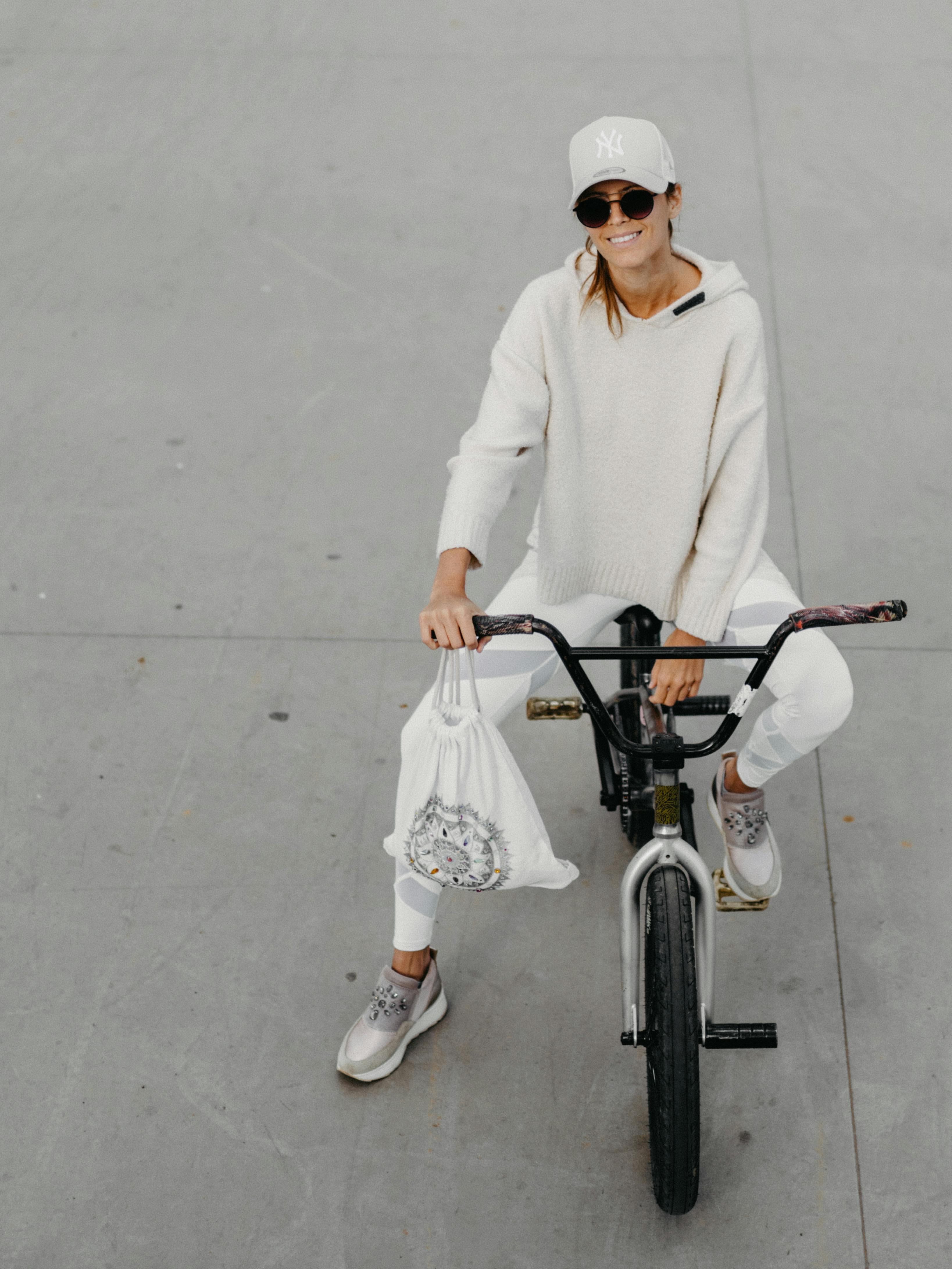 Smiling Woman Sitting on BMX Bike · Free Stock Photo