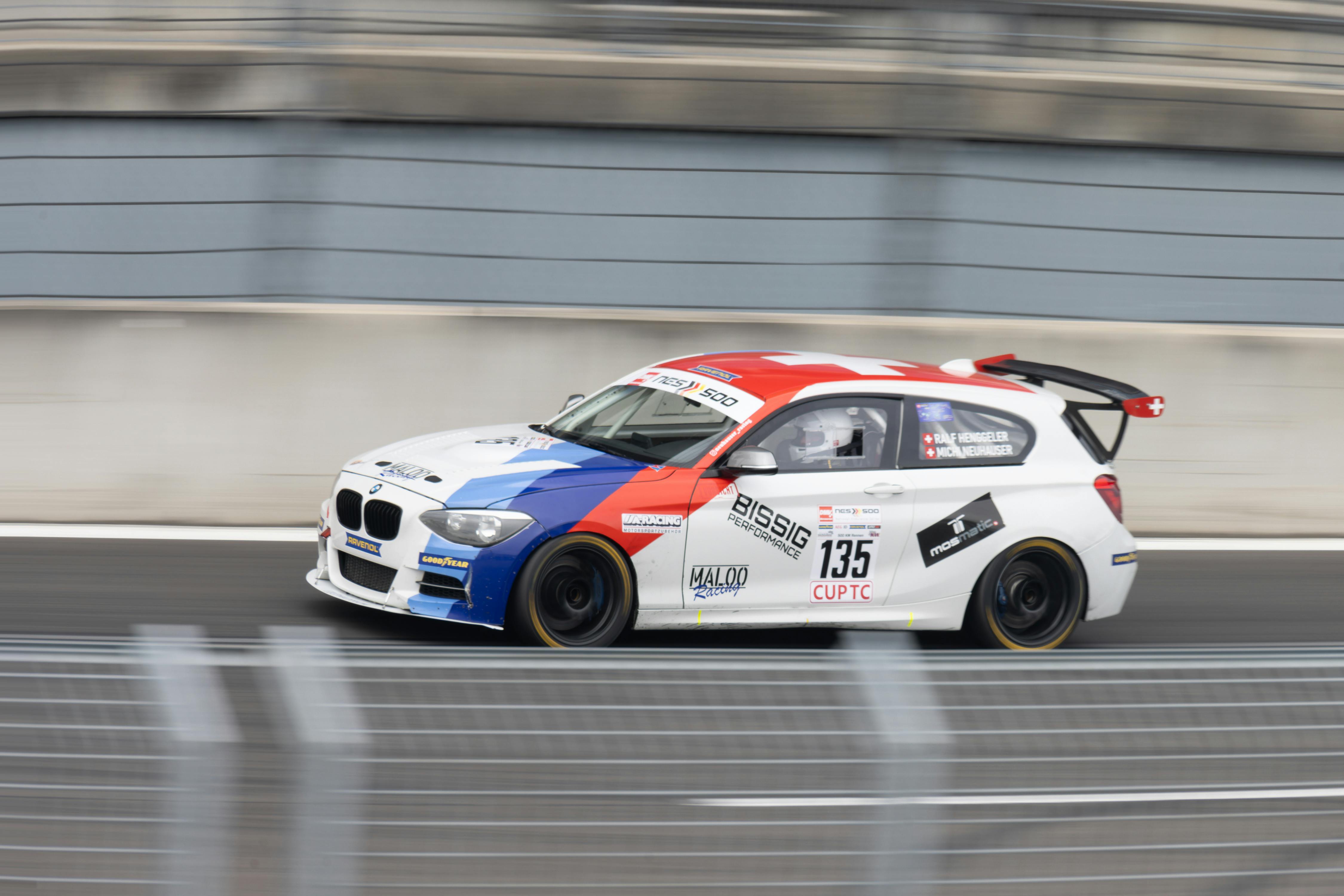 High-Speed Racing Car on Track · Free Stock Photo