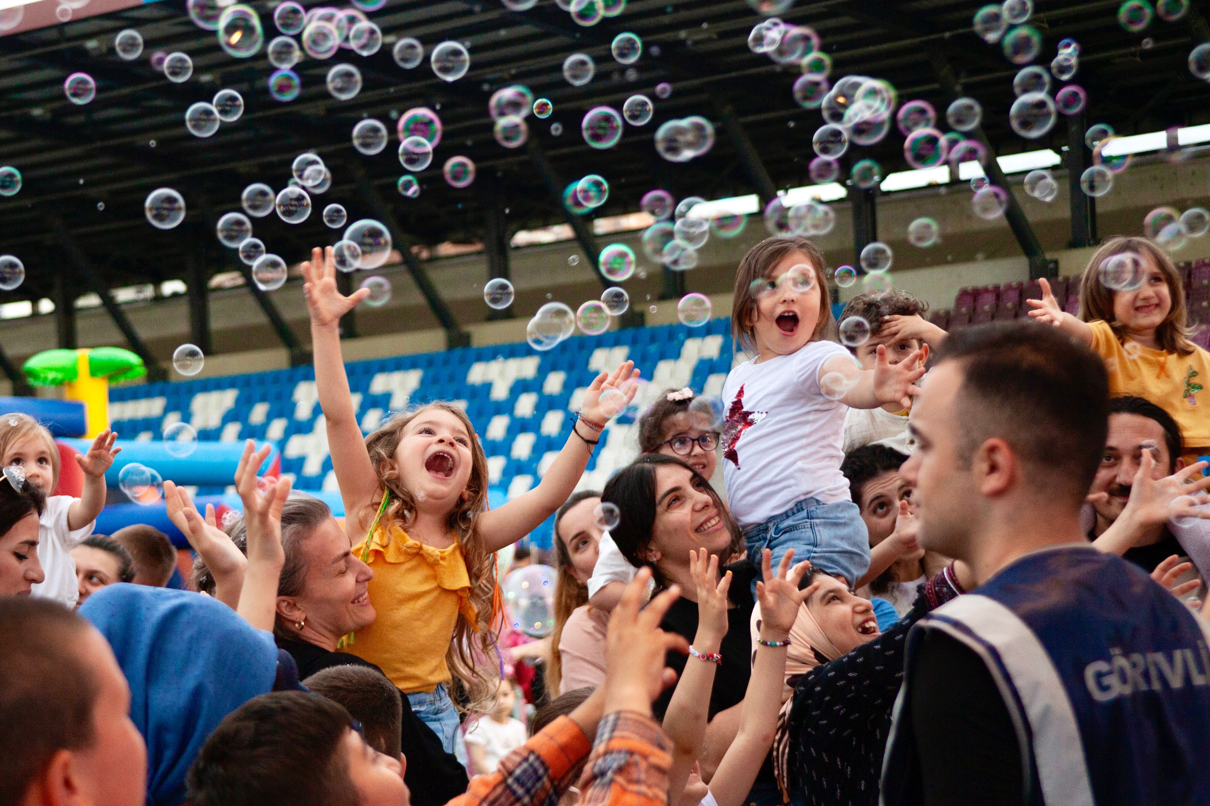 A Group of Kids Catching Soap Bubbles · Free Stock Photo