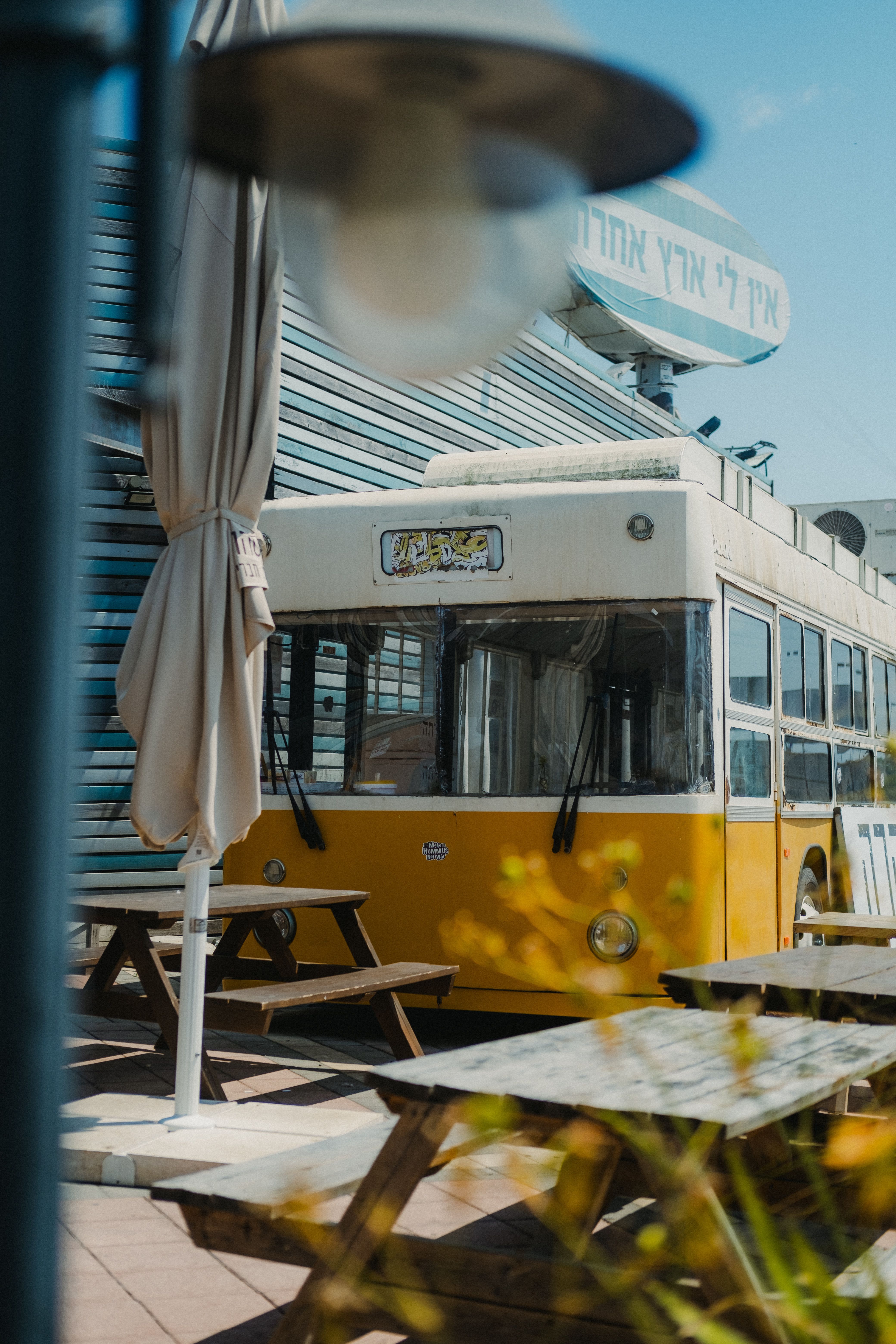 Patio of Restaurant with Bus · Free Stock Photo