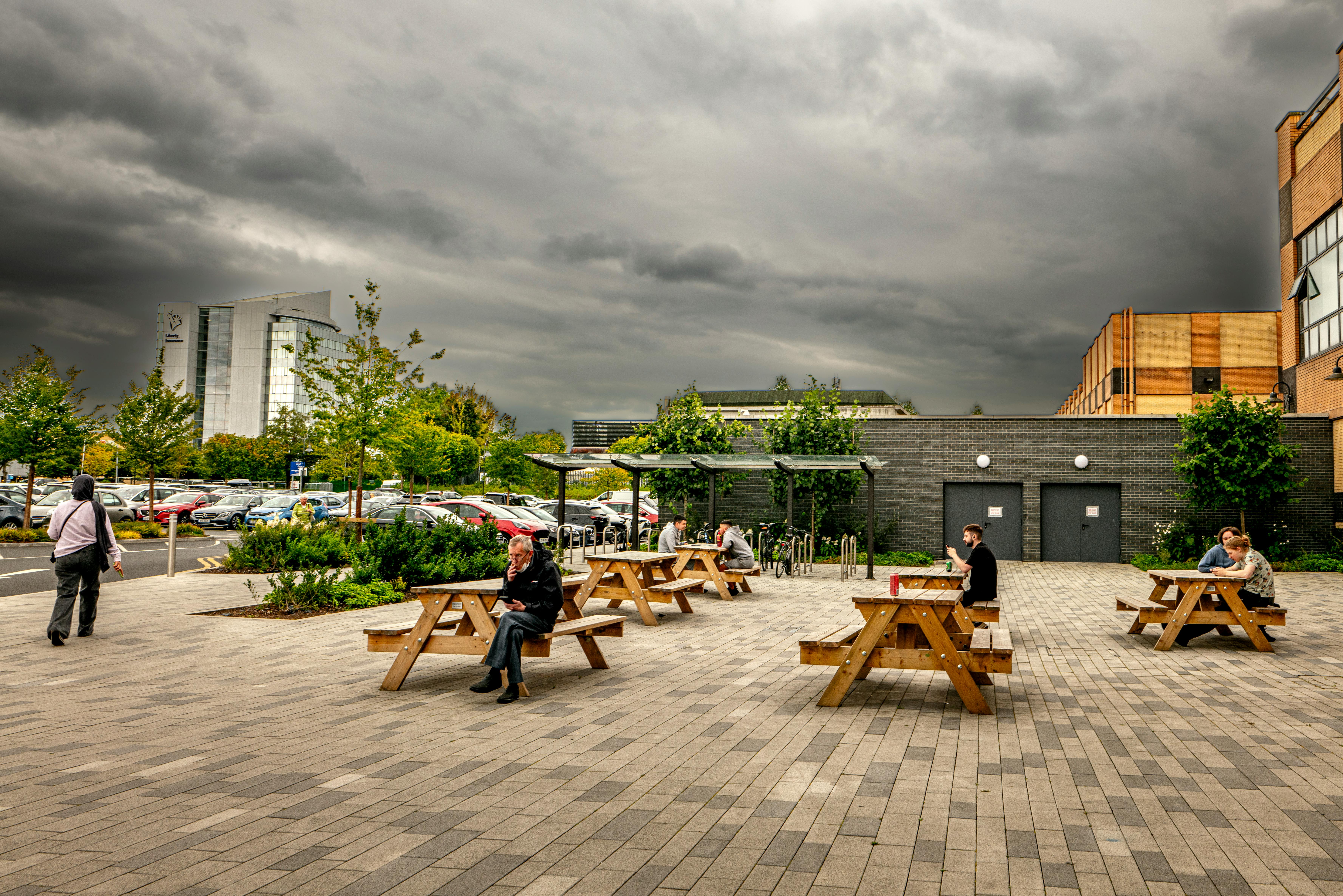 People Sitting on Square in City · Free Stock Photo