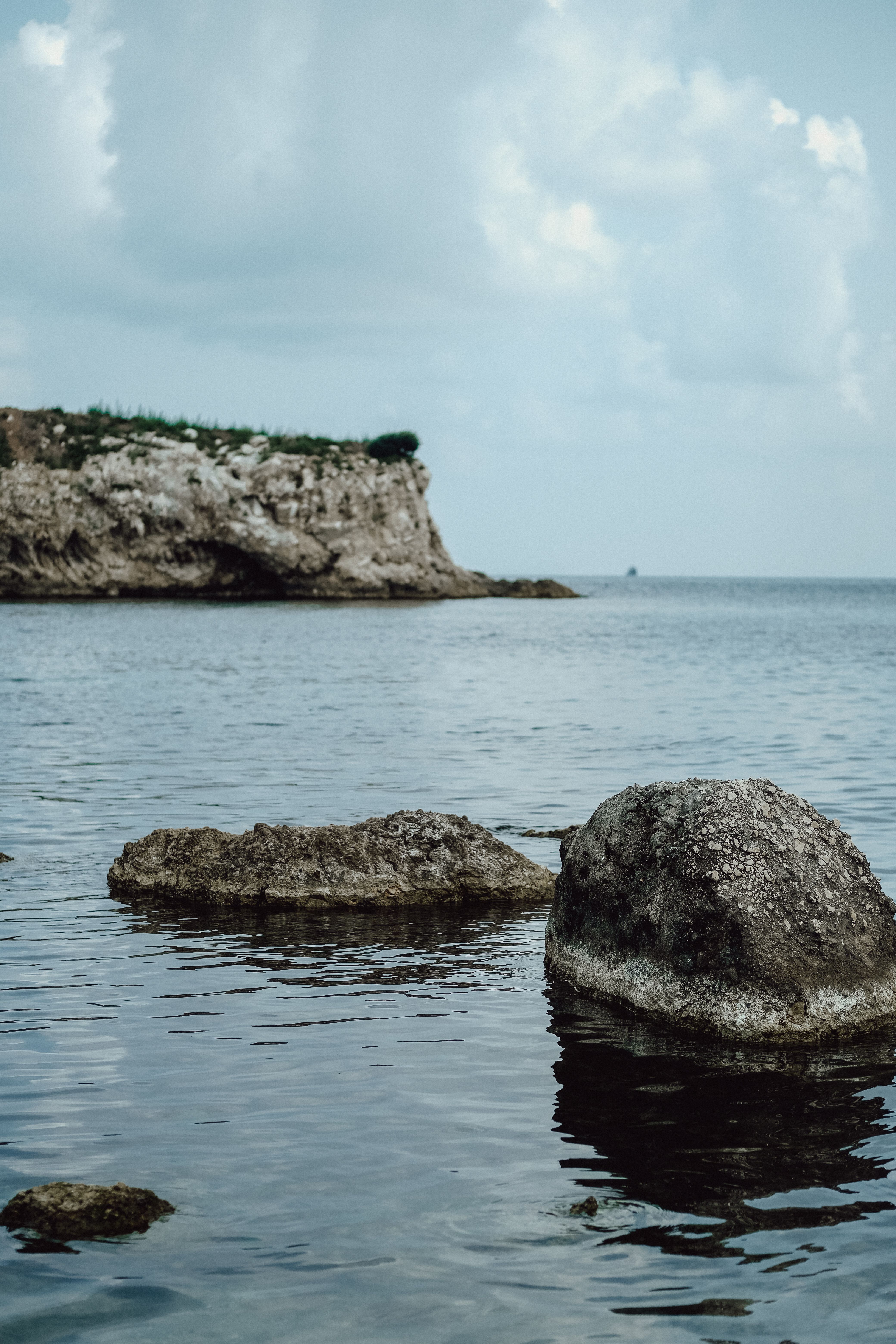 Rocks and Cliff on Sea Coast · Free Stock Photo