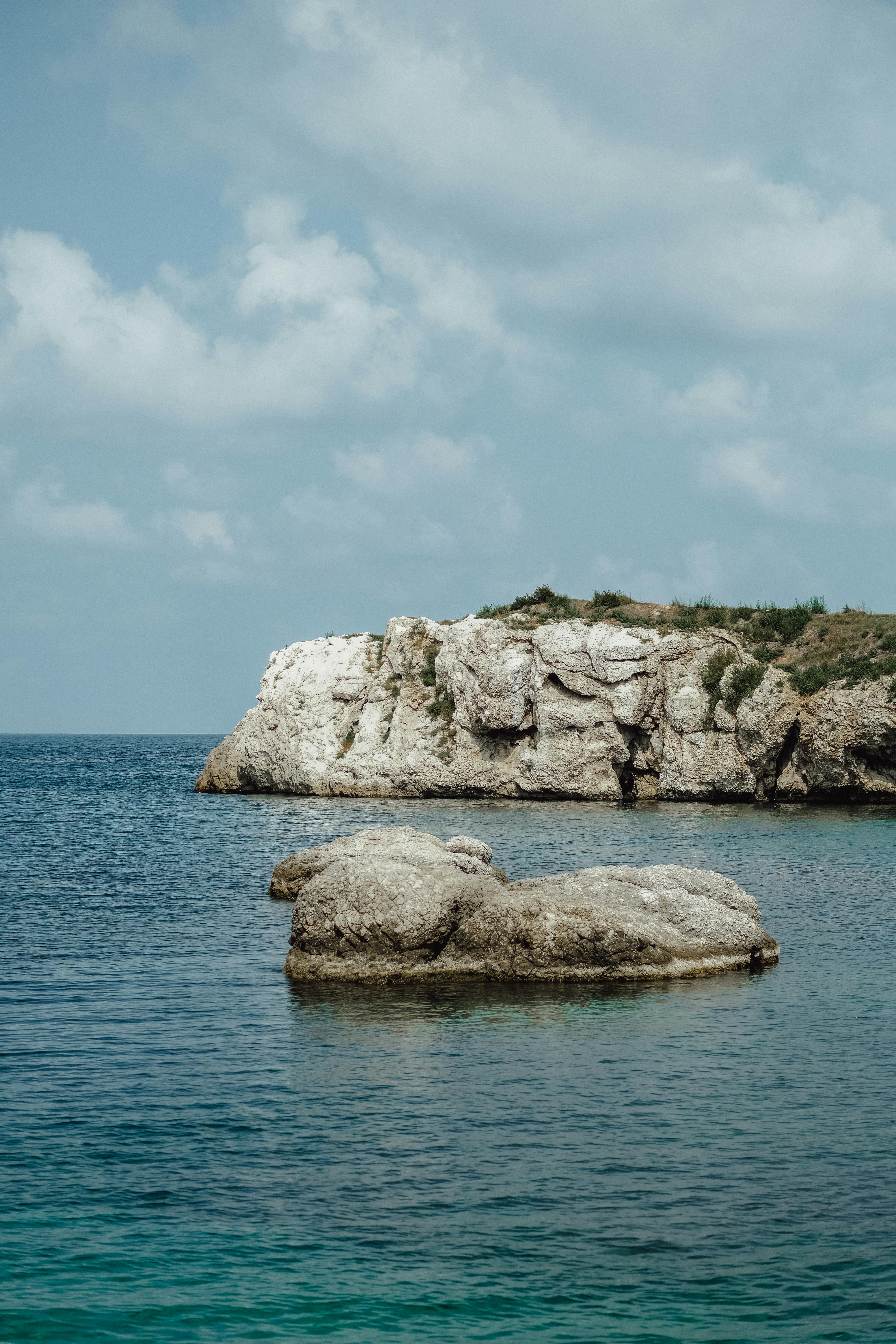 Rocks and Cliff on Sea Coast · Free Stock Photo