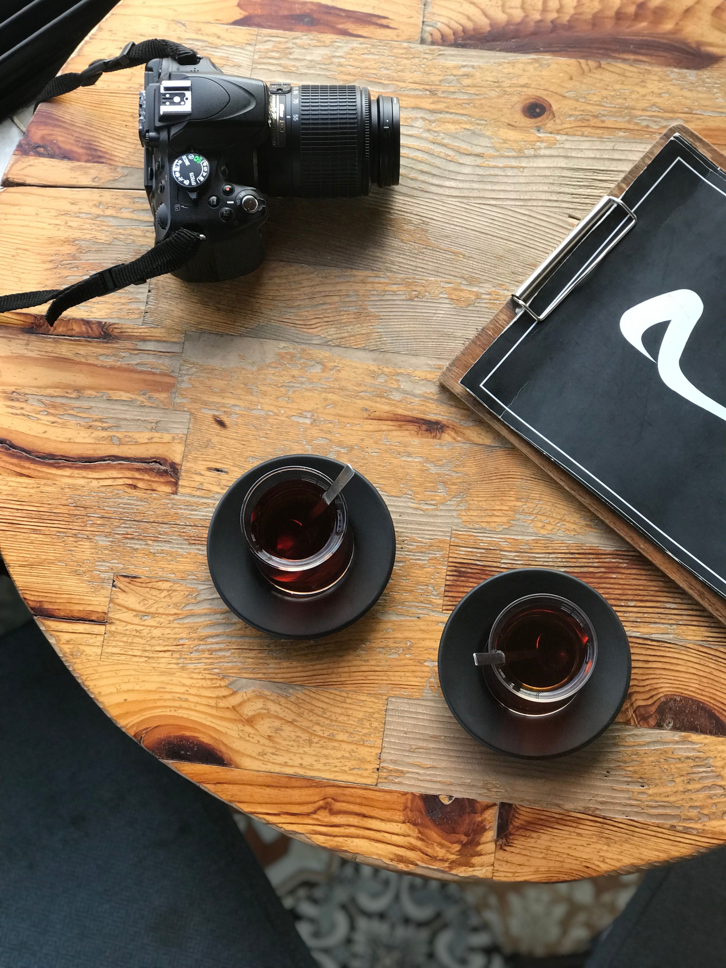 Glasses of Tea and Camera on Table · Free Stock Photo