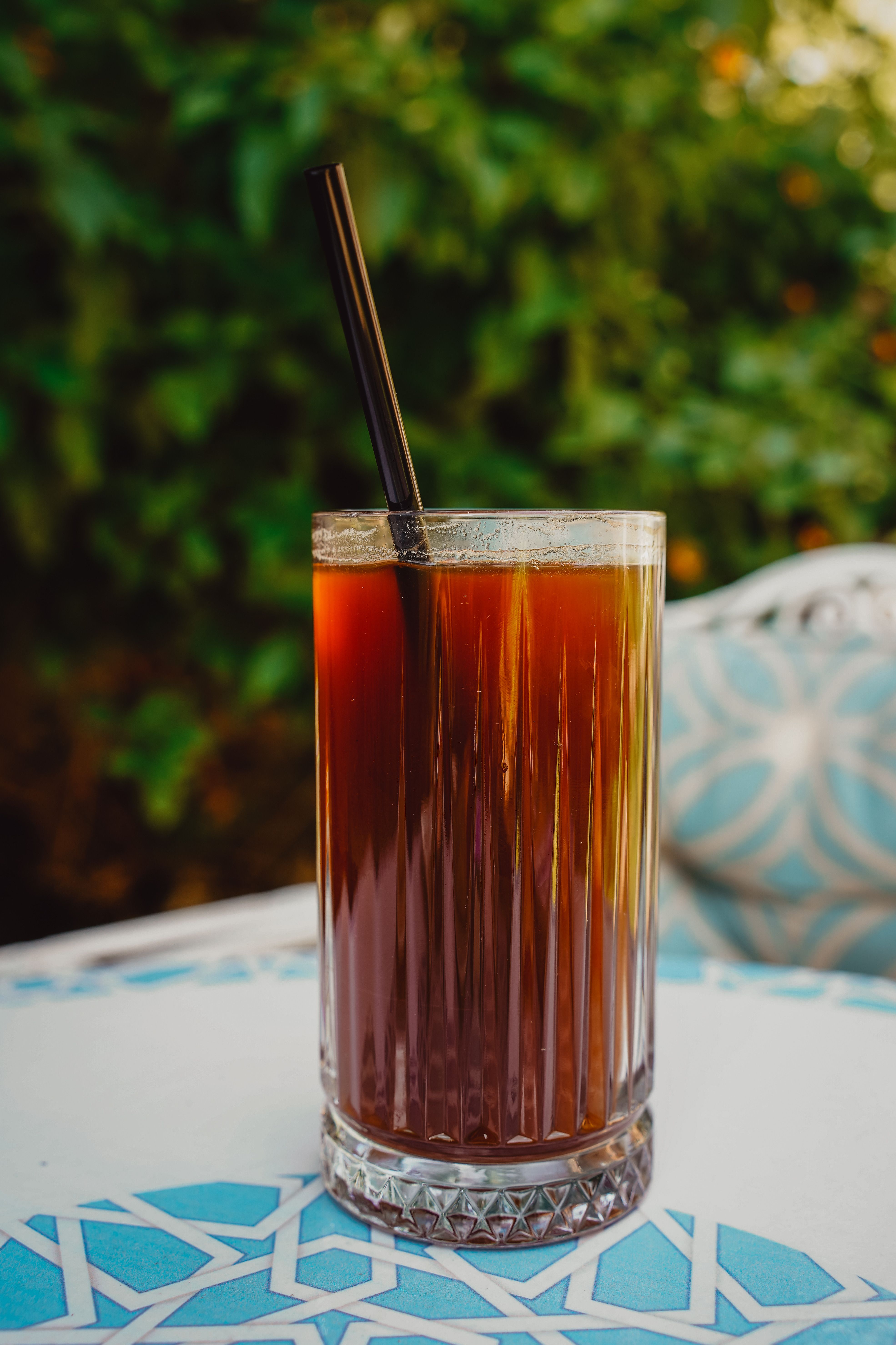 A glass of iced coffee with a straw · Free Stock Photo